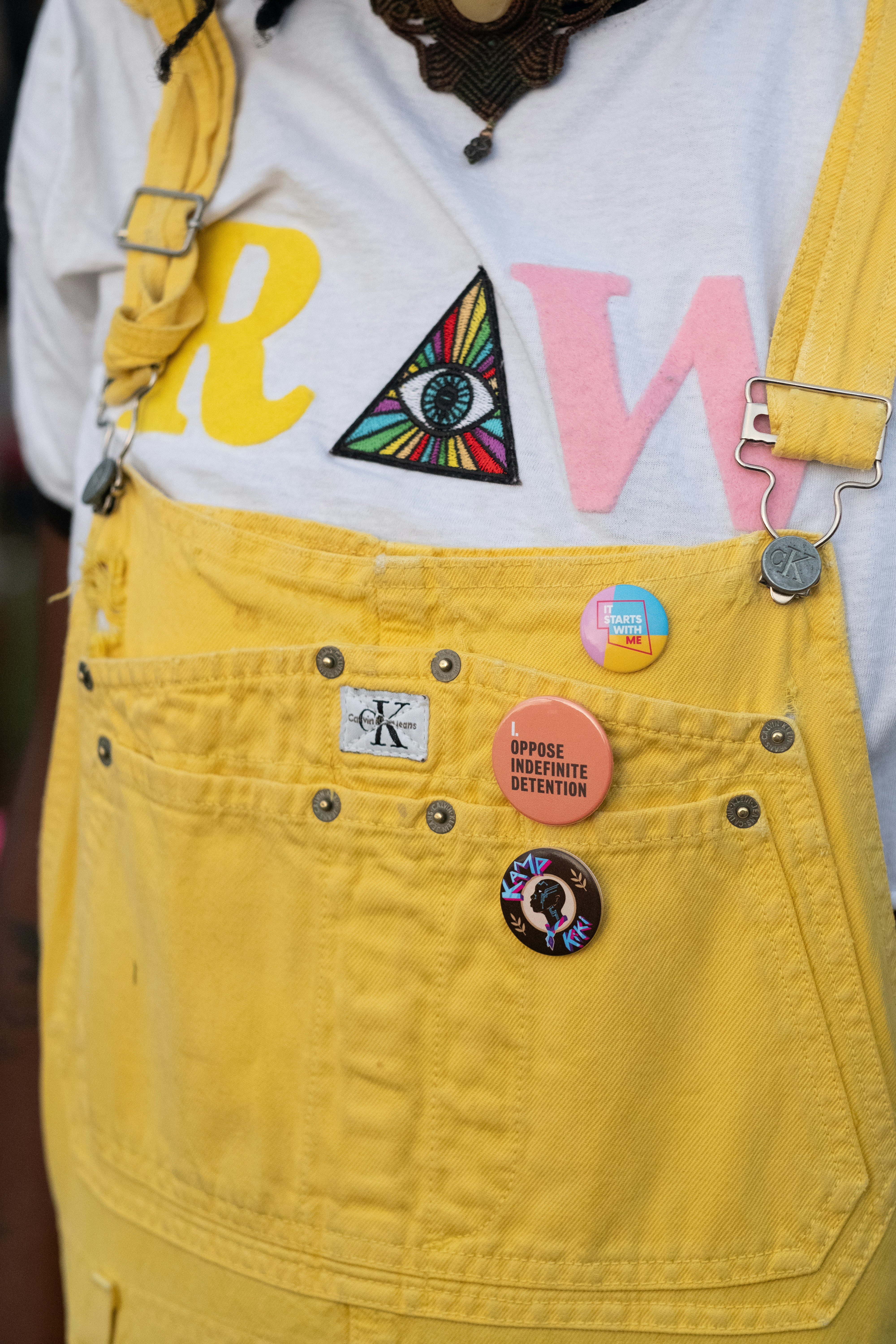 Badges on a yellow dungaree | yellow denim apparel