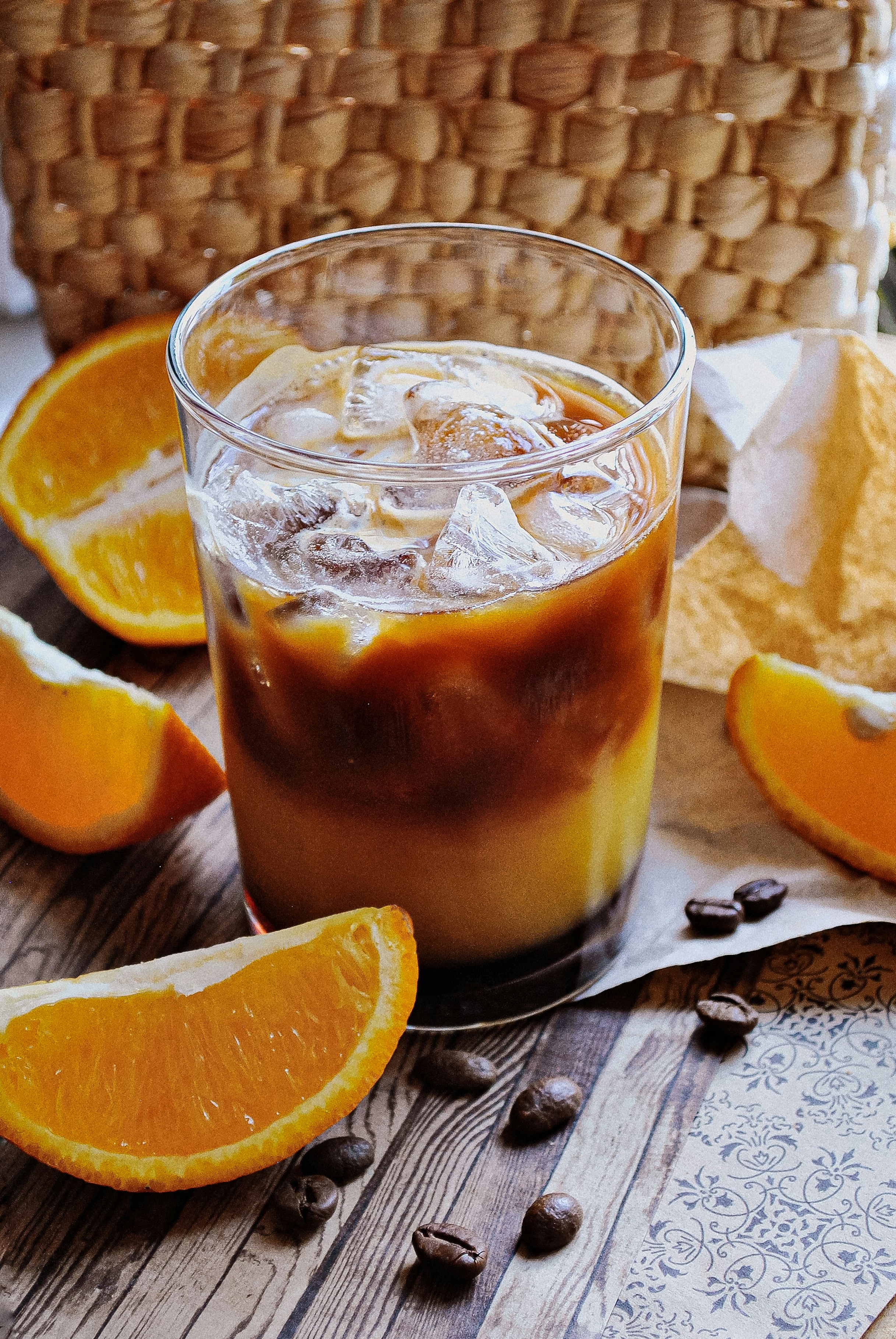 Layered Iced Coffee with Orange Zest on a Rustic Table