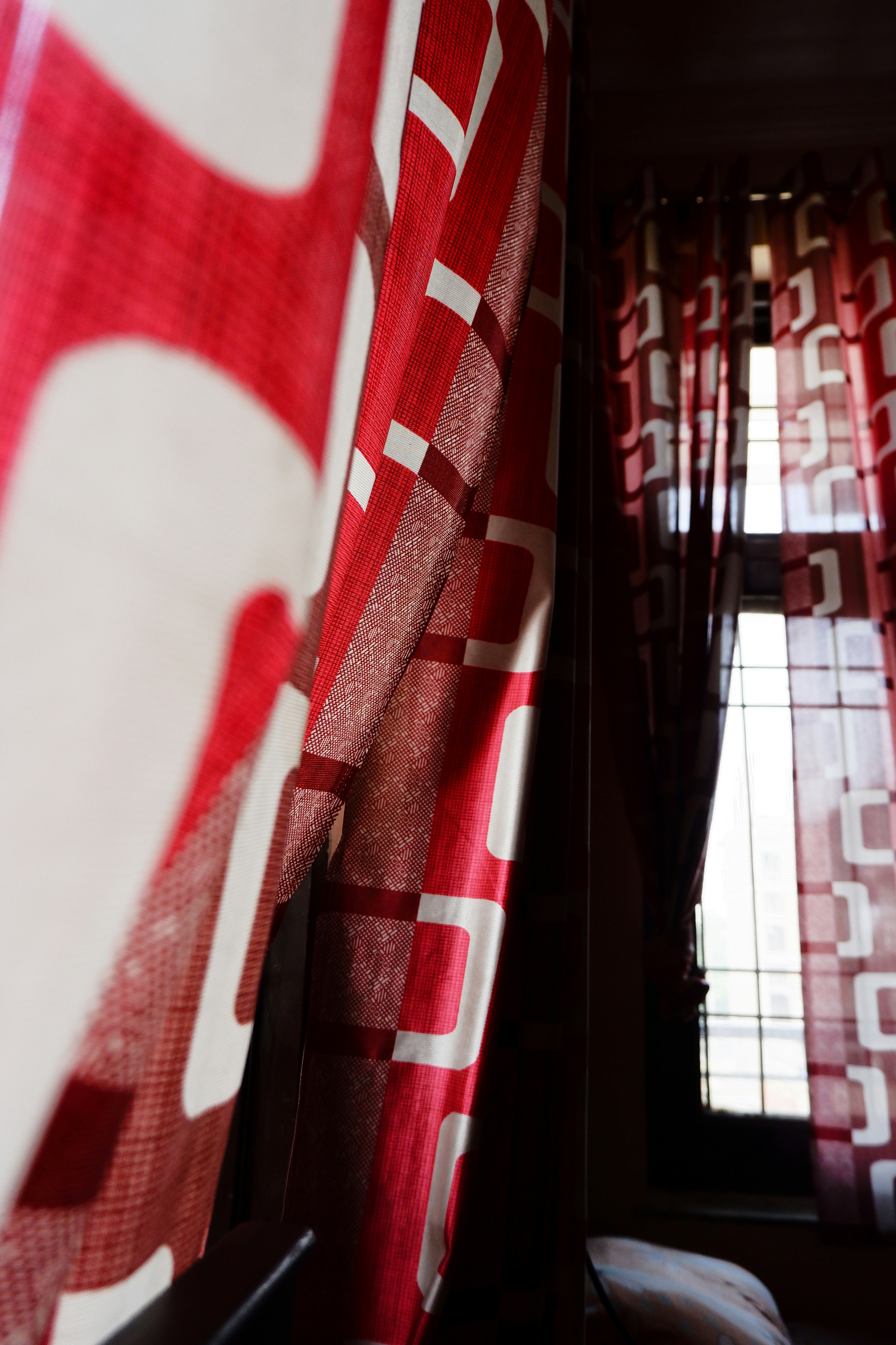 Red Curtain Corridor to Lighted Window