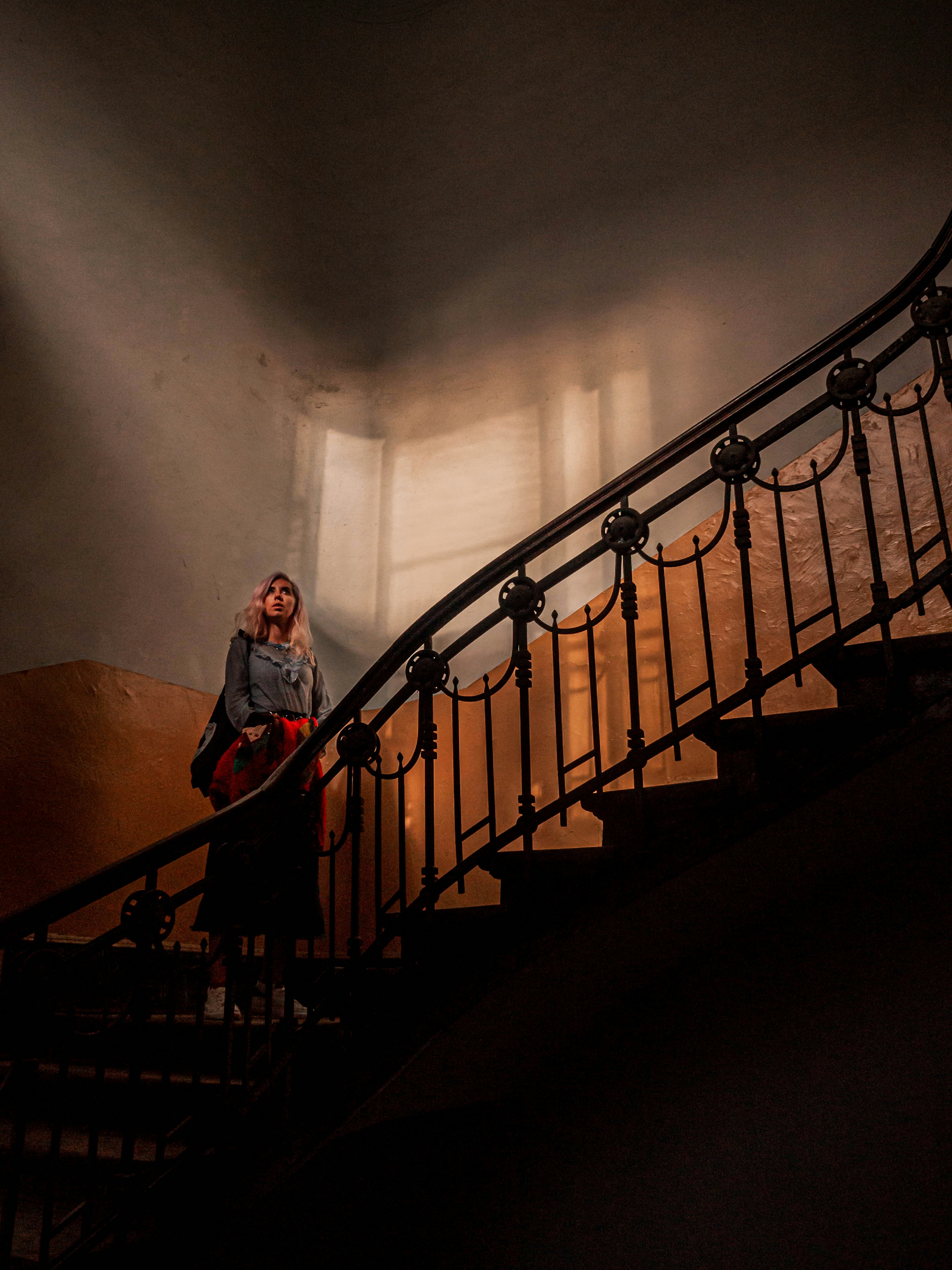 Staircase Portrait in Dim Hallway