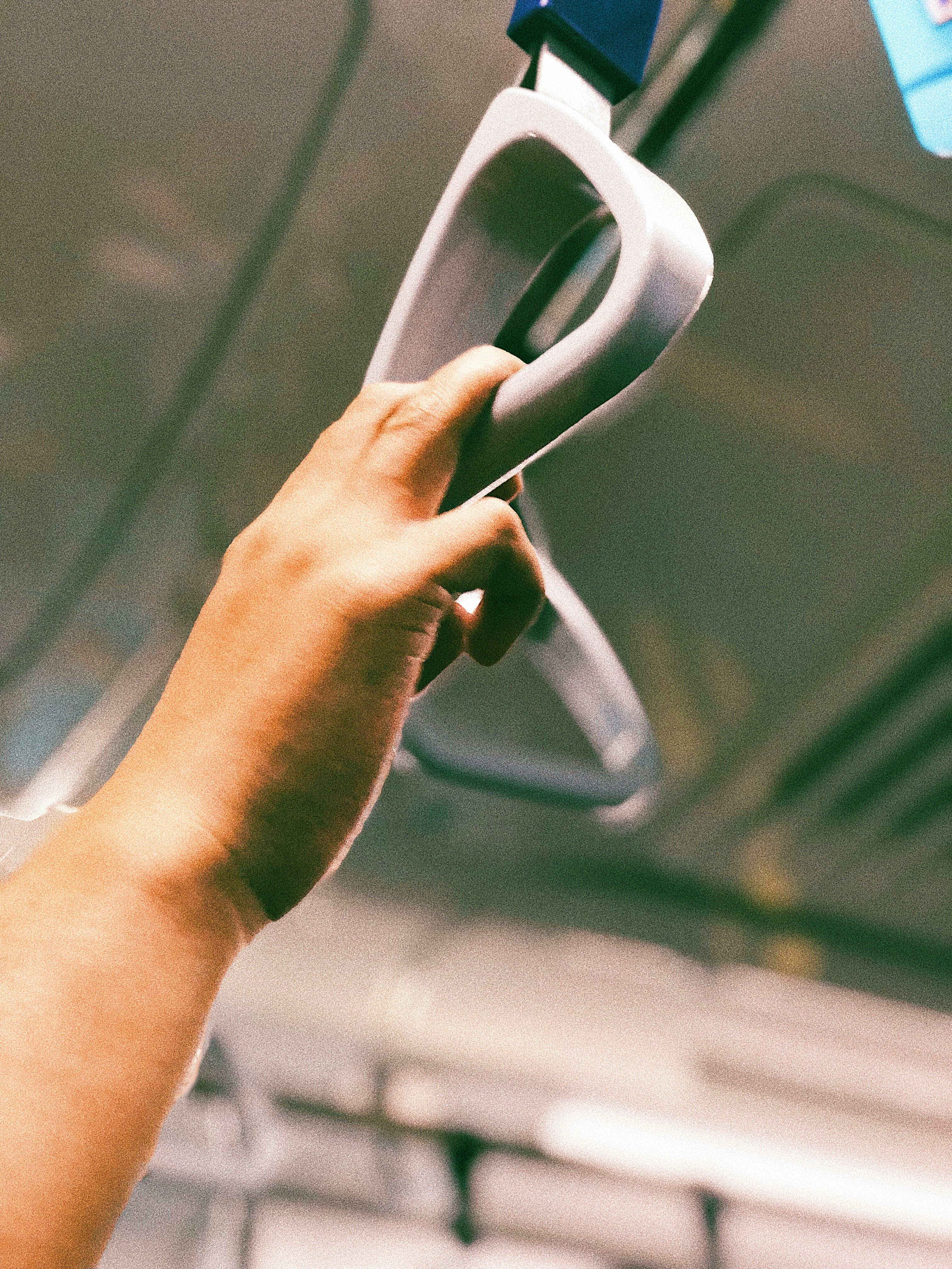 Grip on the Transit Strap: A Moment in Motion