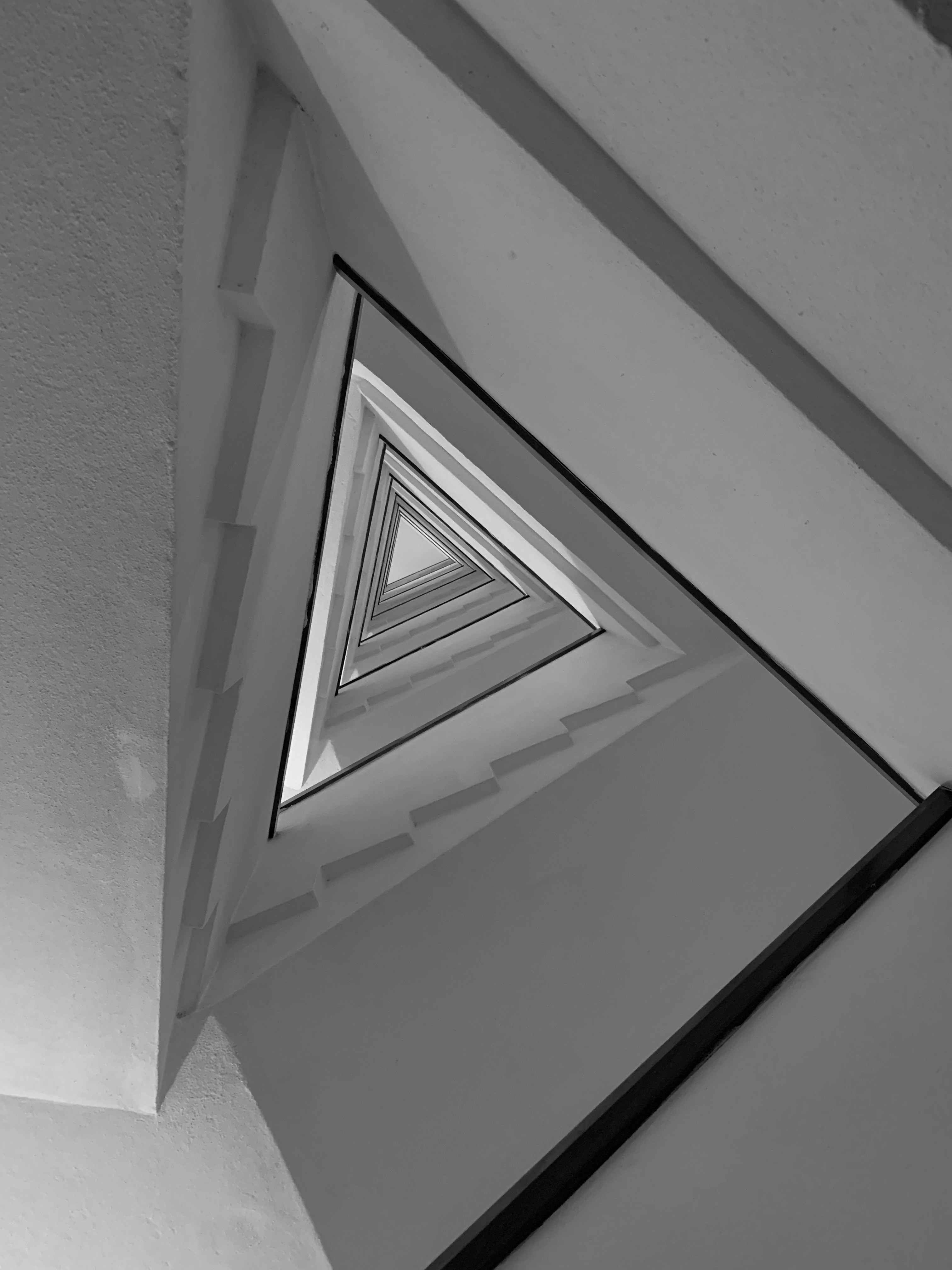 Geometric Ascent: A Triangular Stairwell Perspective