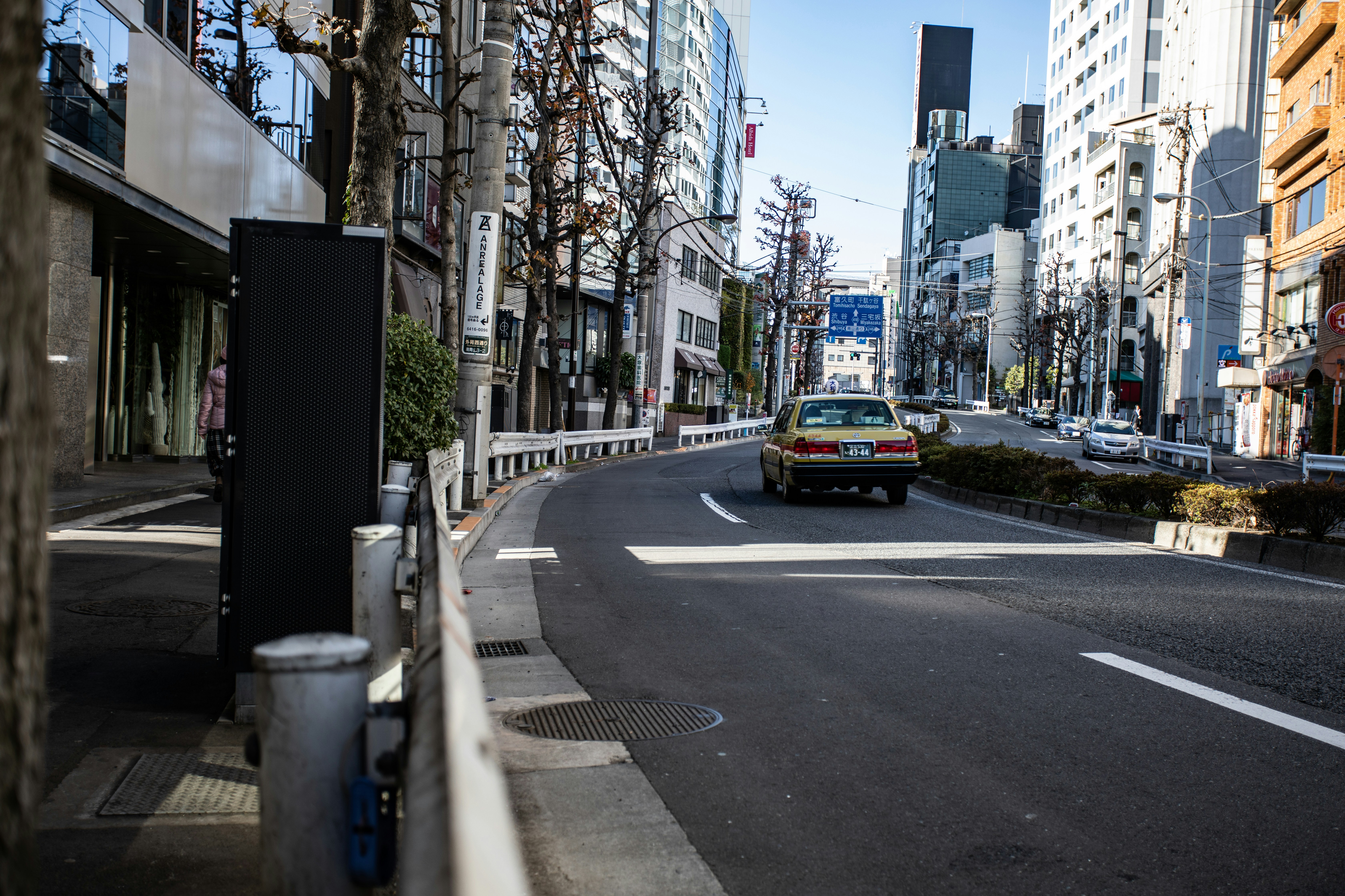 Red car parked beside street photo – Free Tokyo Image on Unsplash