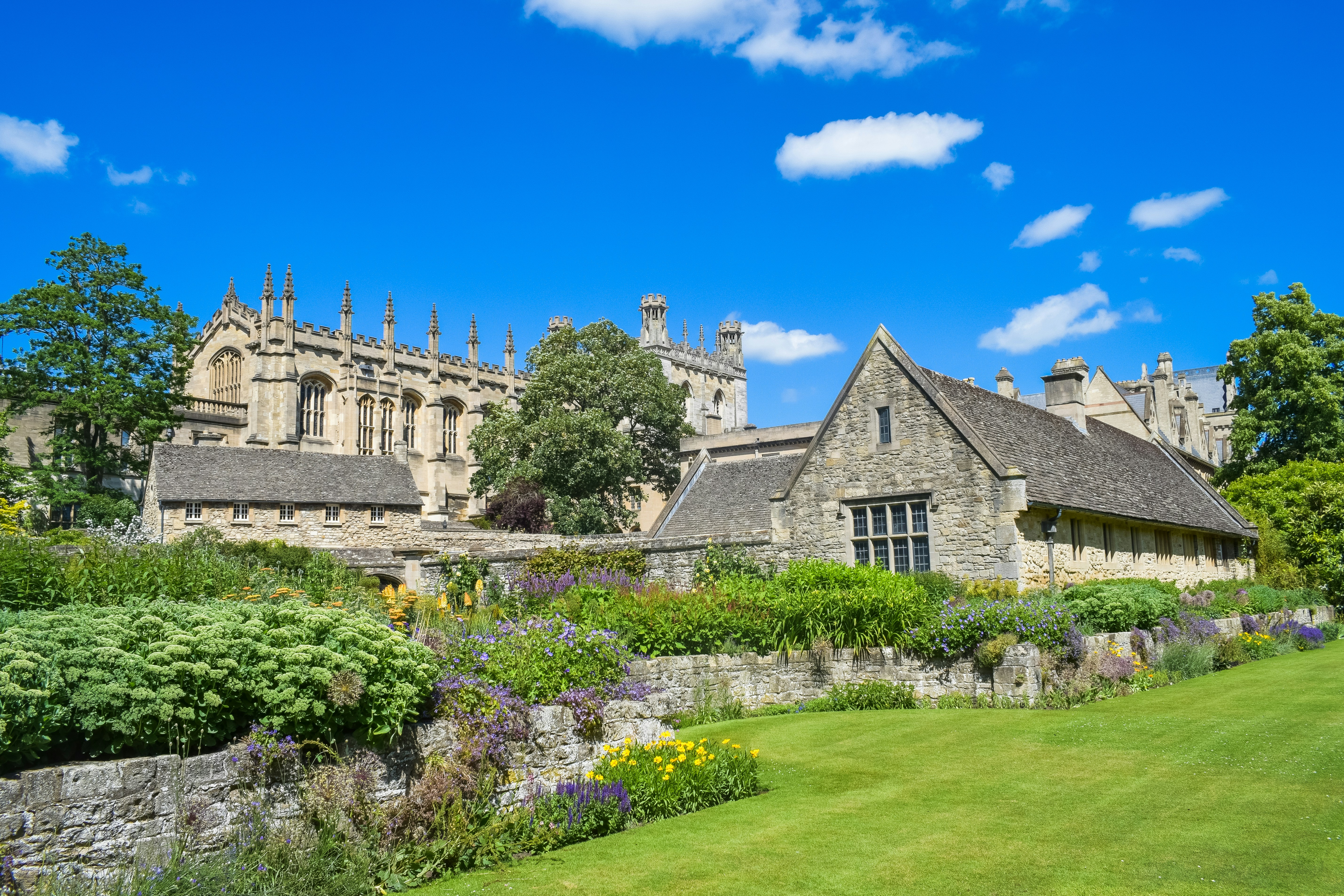 A large stone building with a garden in front of it photo – Free The uk ...
