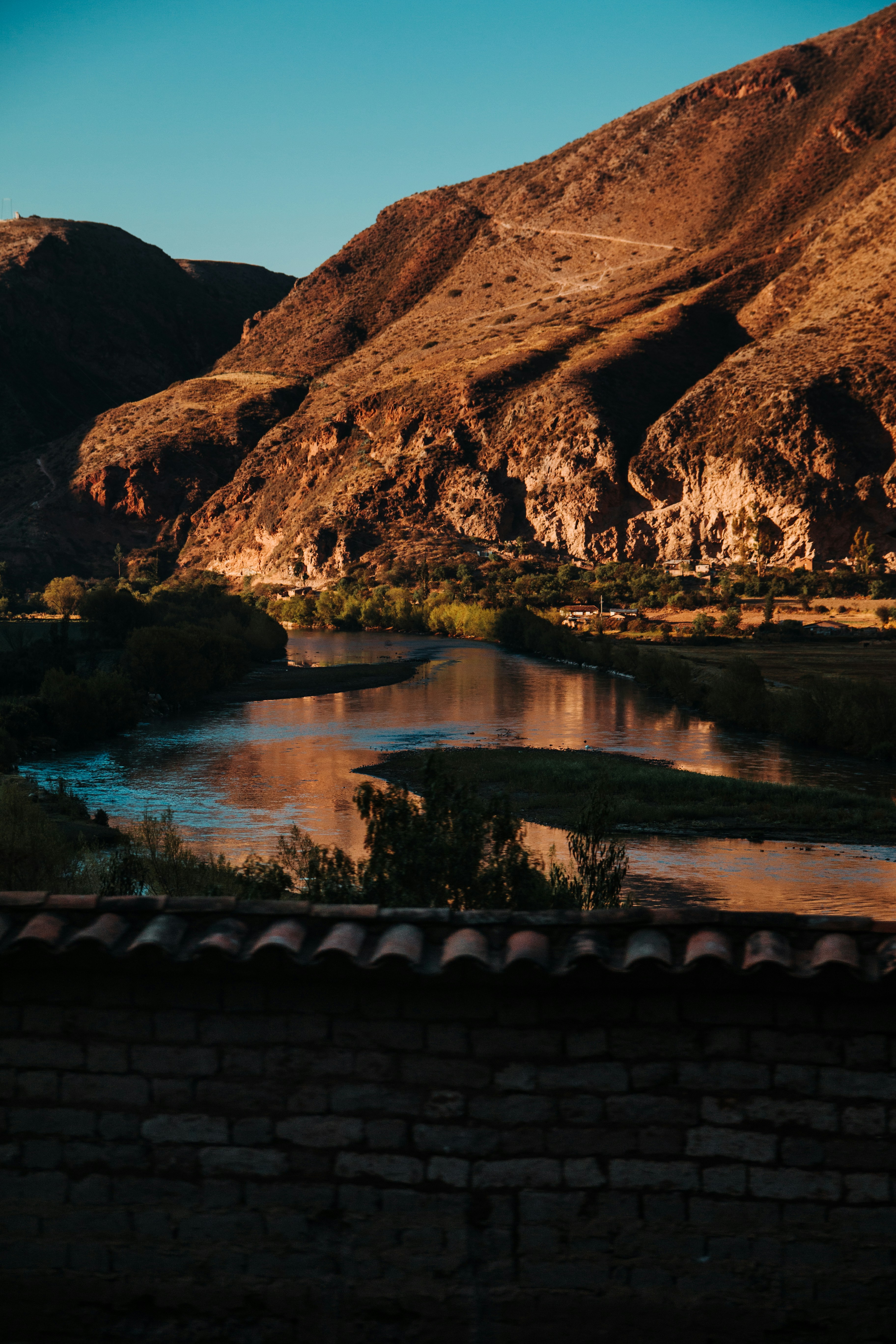 Golden Hour Reflections Beneath Majestic Peaks