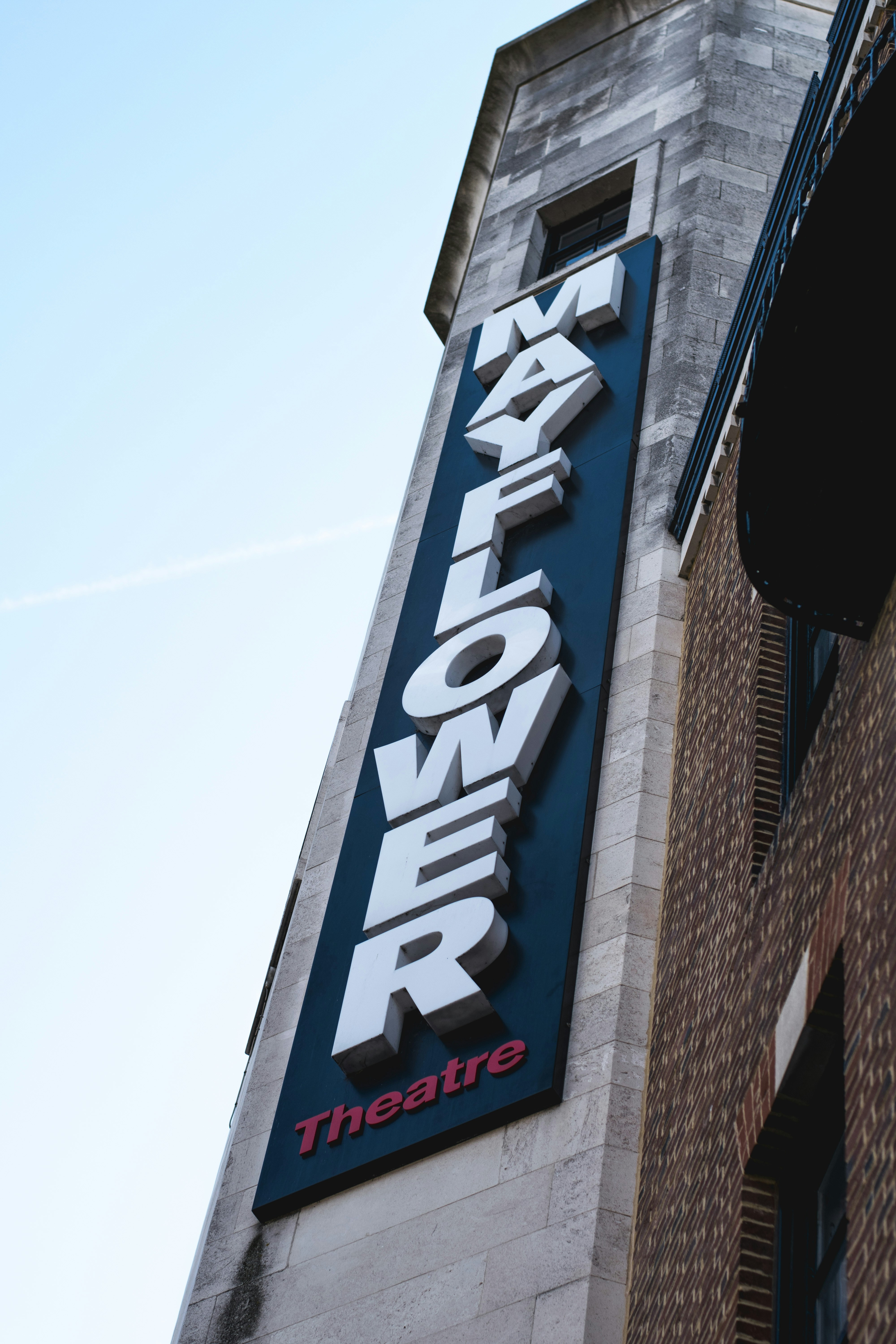 Mayflower Theater building under blue and white skies photo – Free ...