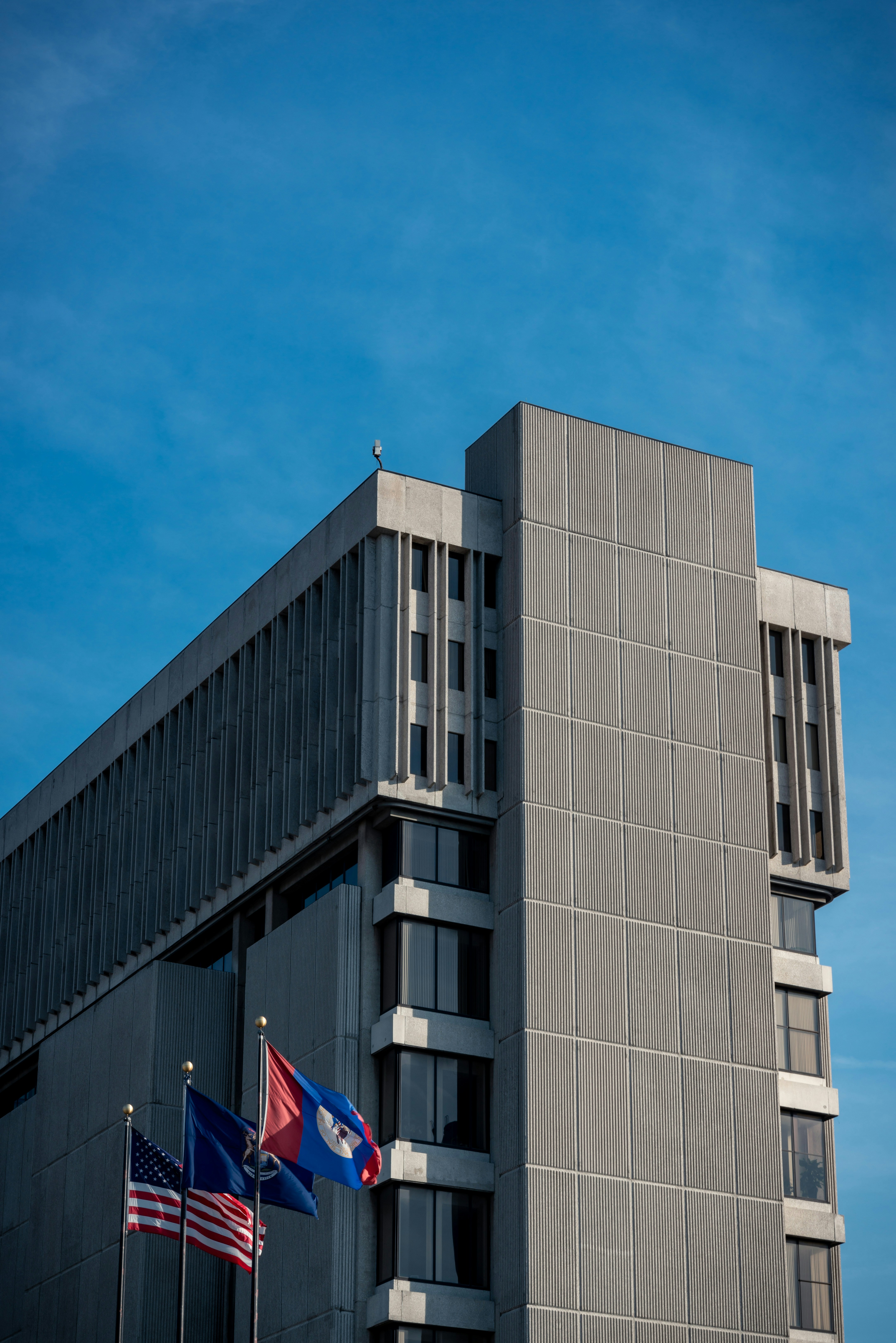Grey concrete building photo – Free Blue Image on Unsplash