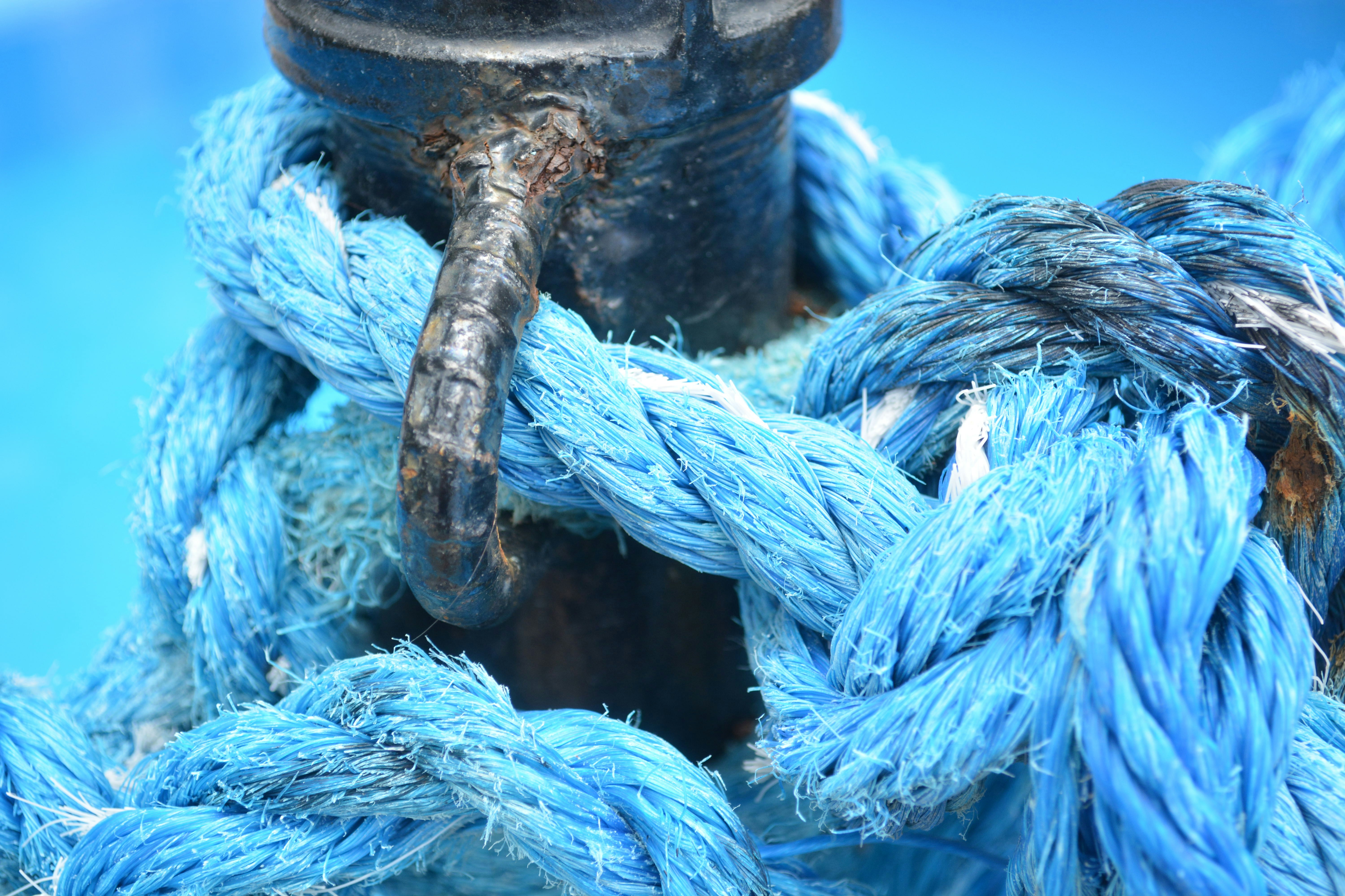 Azure Fiber Knot: Close-Up on a Weathered Mooring Shackle