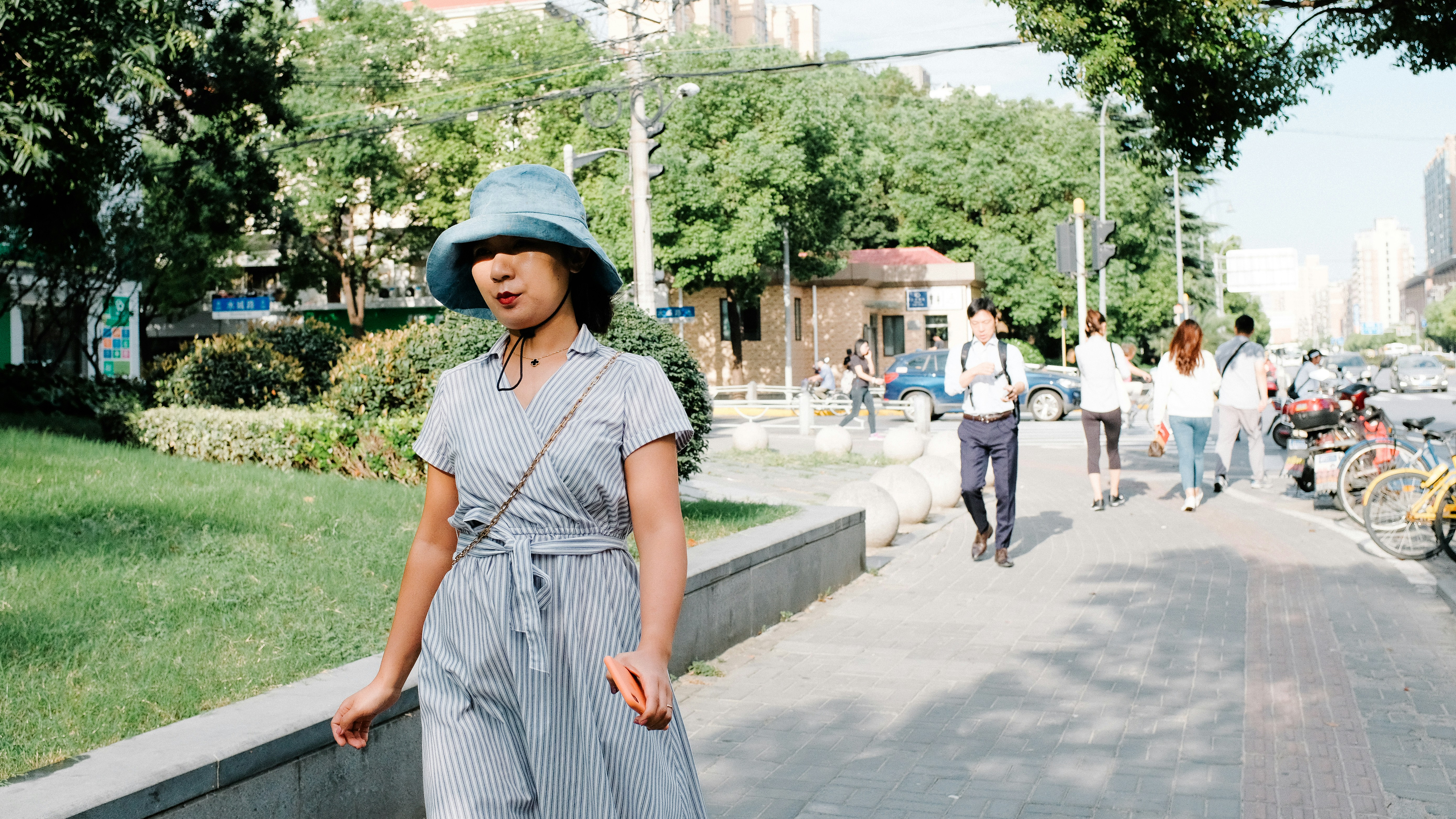 Blue Hat, Striped Dress: A Morning Street Portrait By the Park