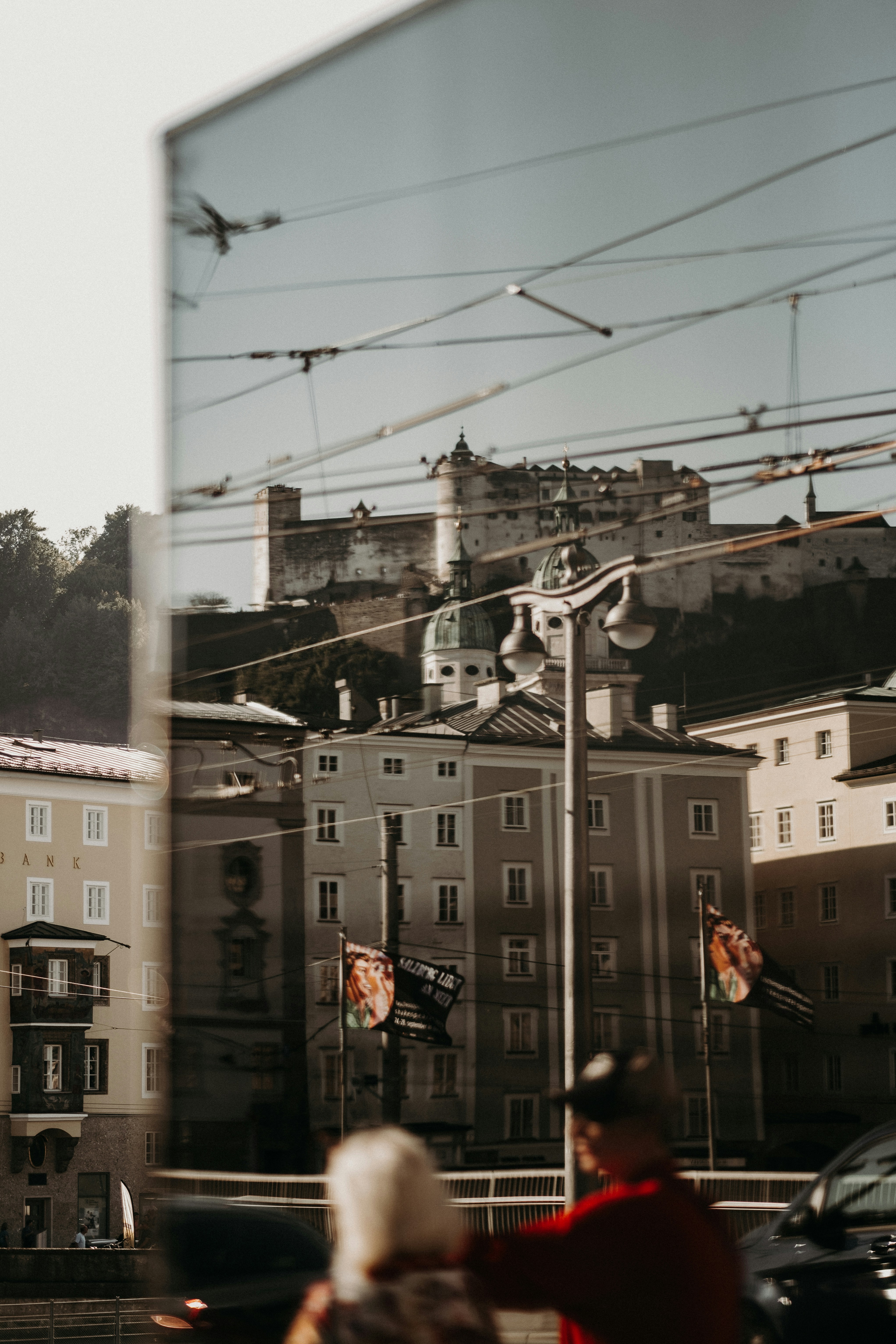 Reflections in the Glass: Cityscape Between Trams and Towers