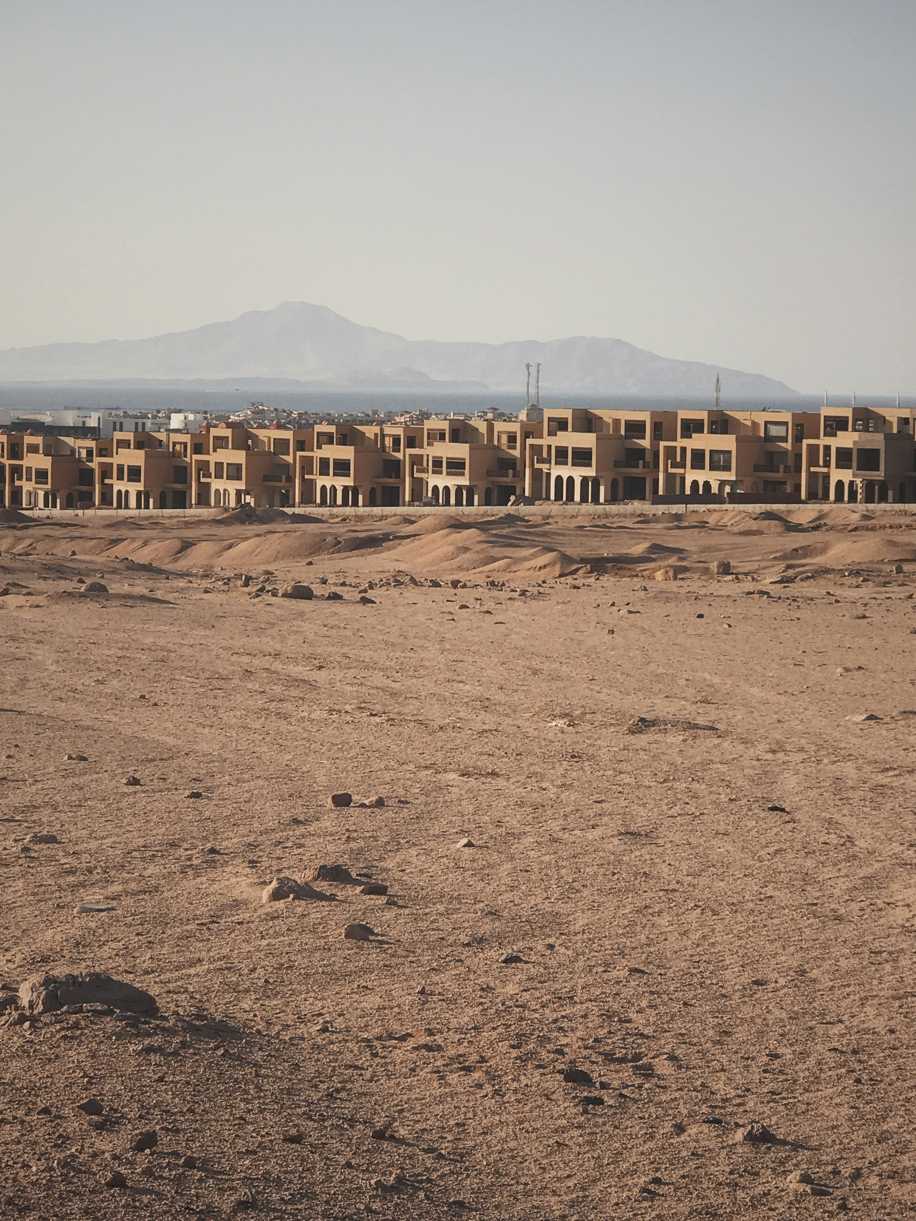 Desert Row: Suburban Blocks Beneath Distant Mountains