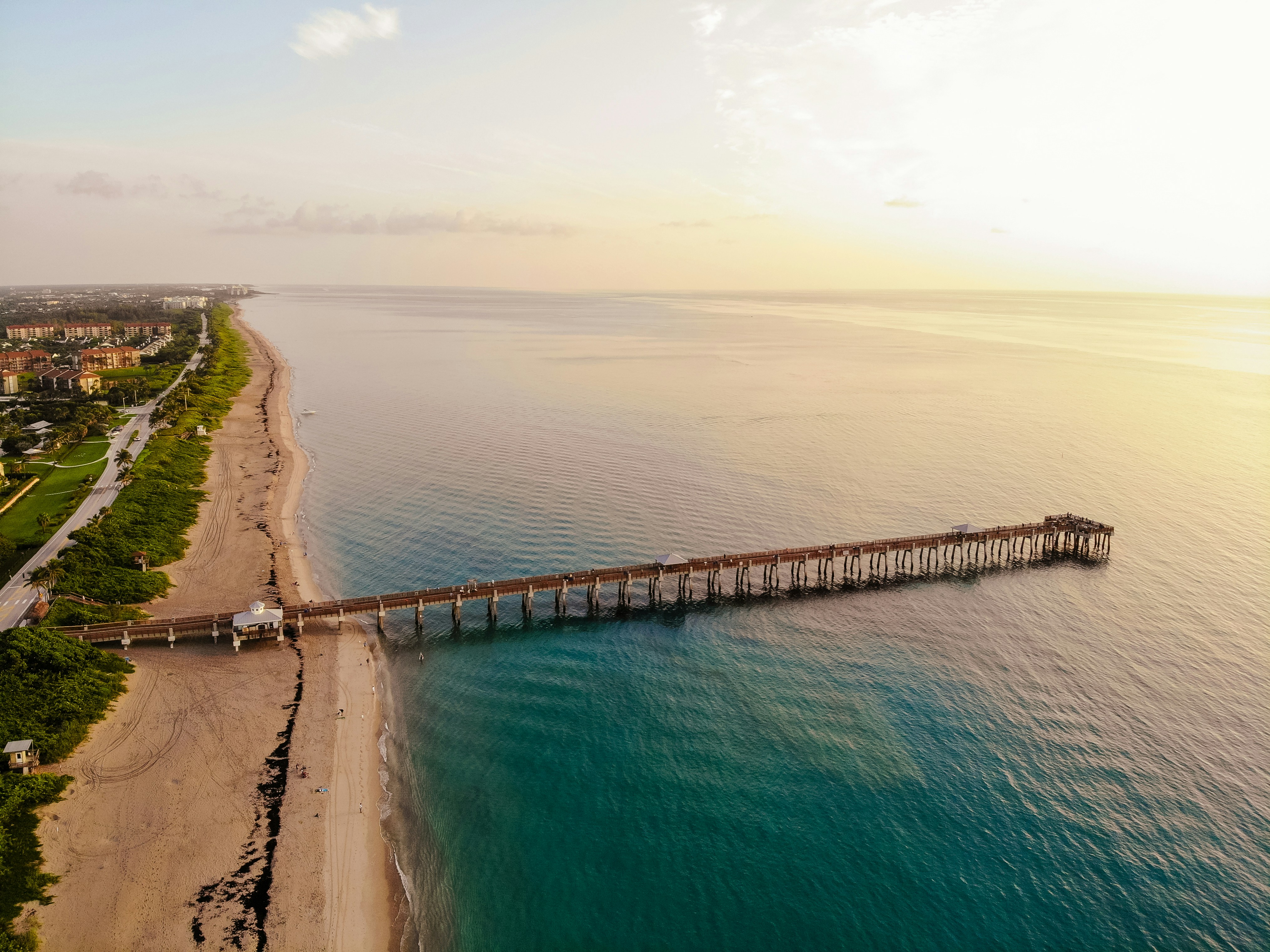 Brown bridge in body of water during daytime photo – Free Water Image ...