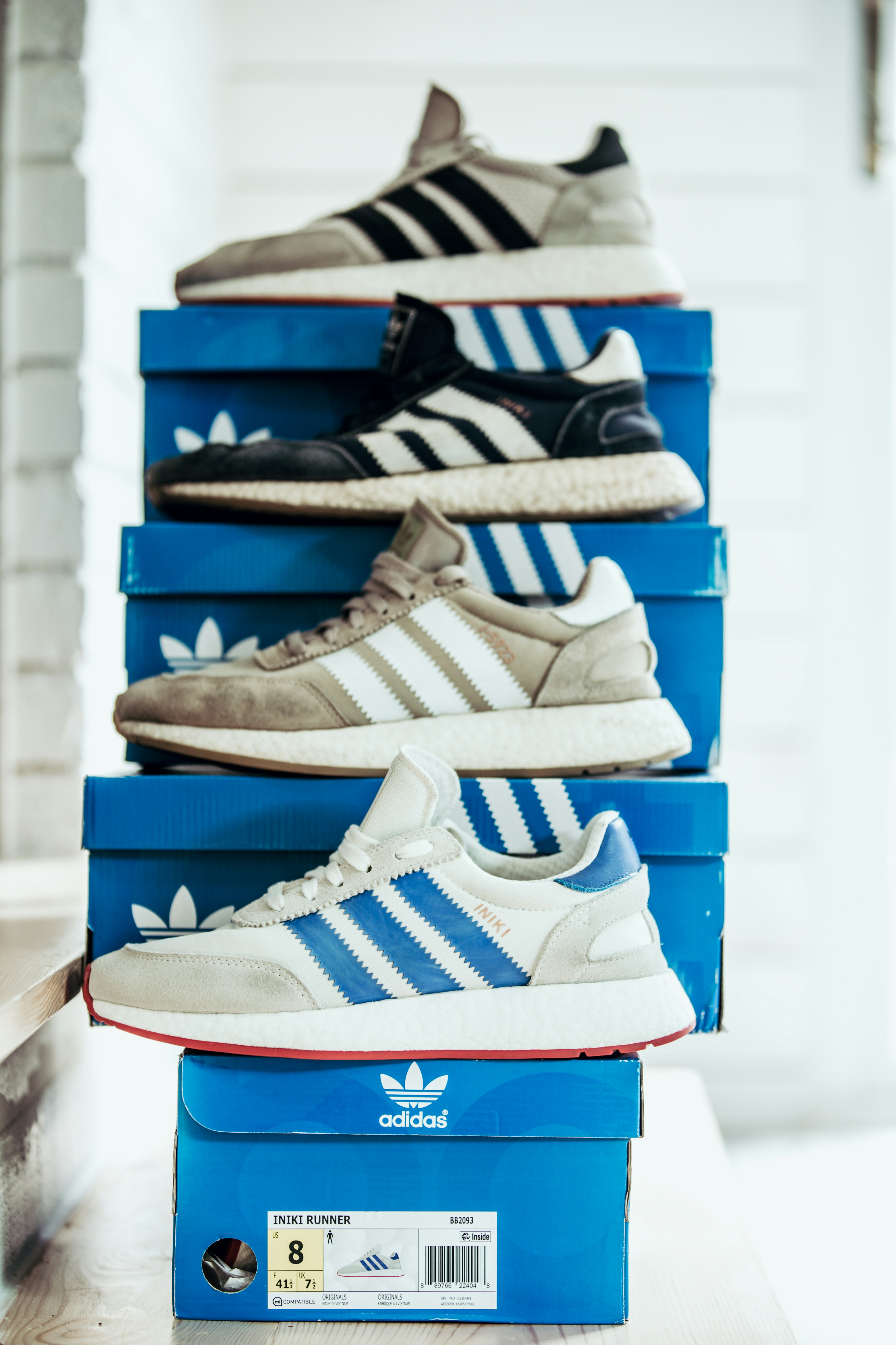 Shallow focus photo of four assorted adidas running shoes photo – Free ...