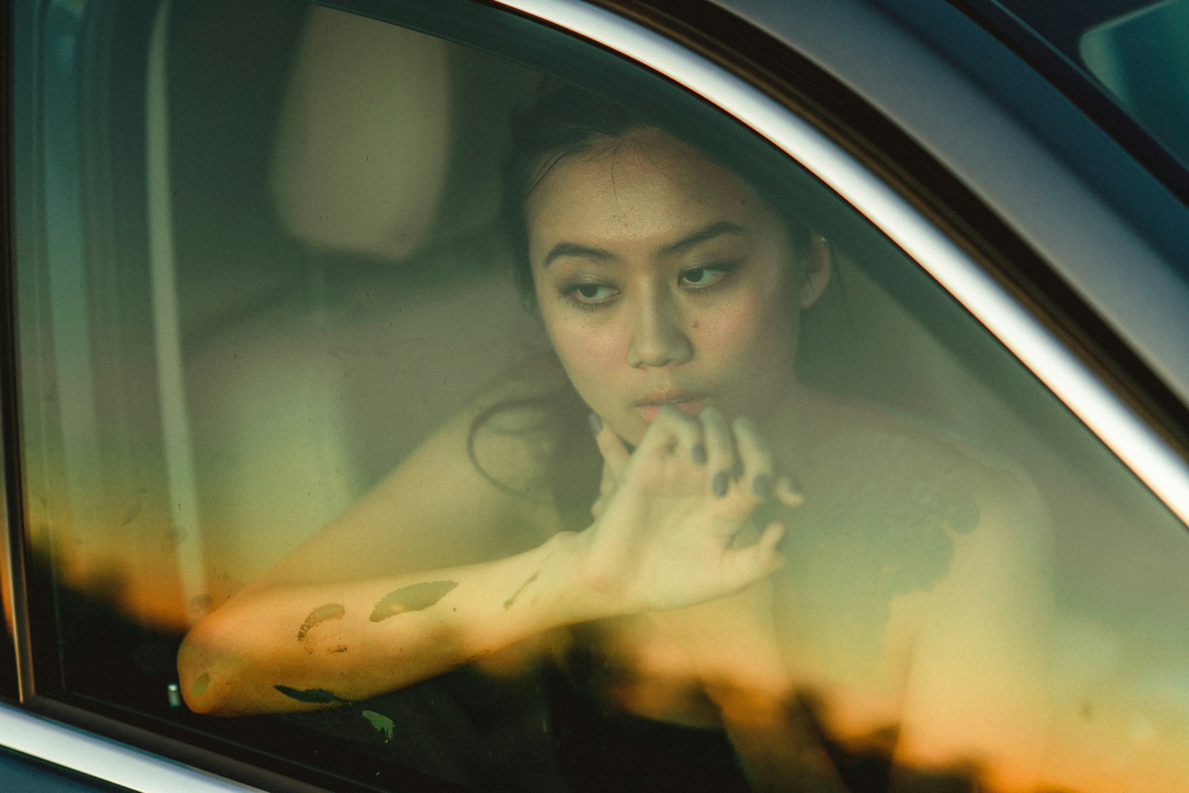Woman sitting inside car photo – Free Skin Image on Unsplash