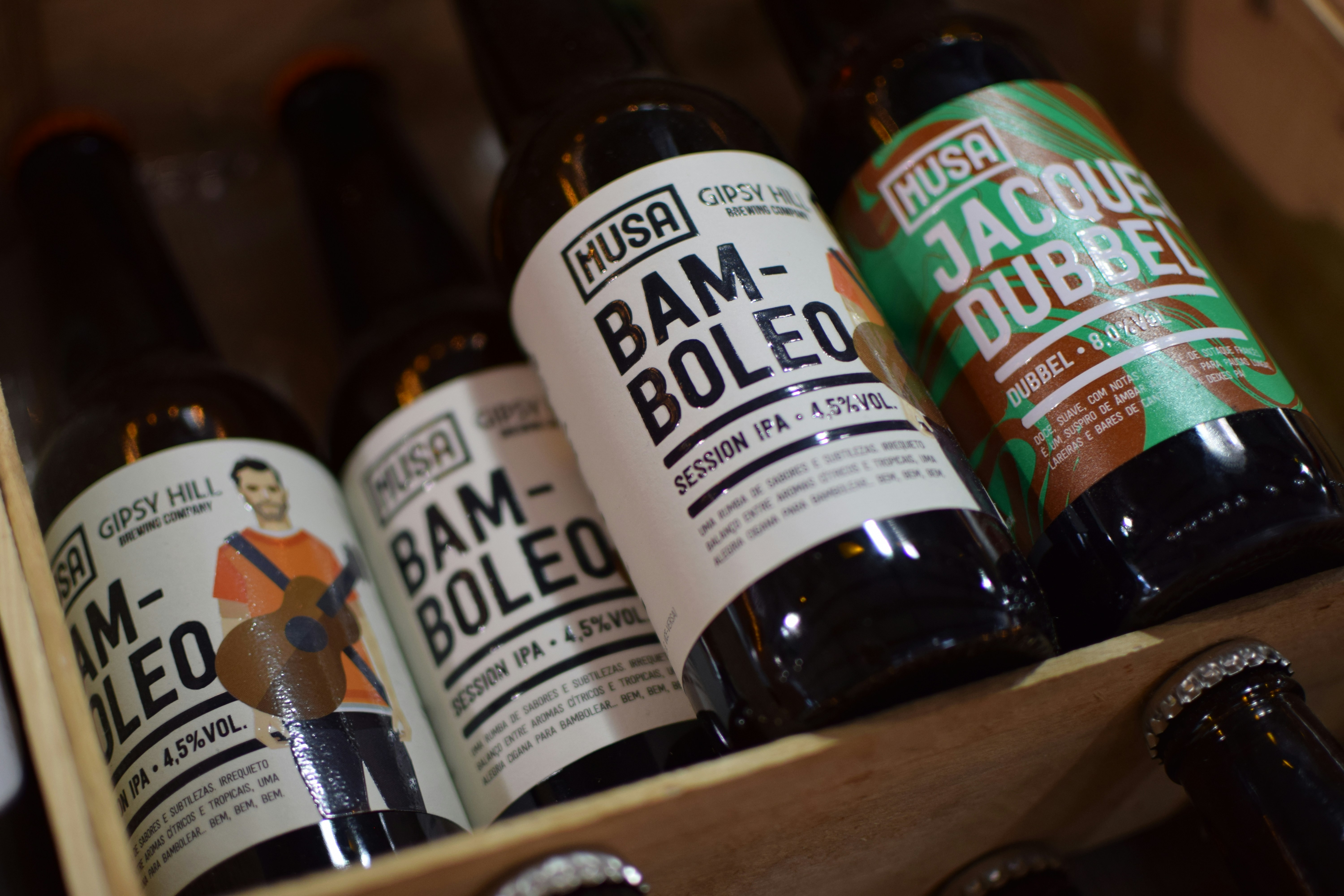 Bottled Rhythm: Row of Craft Beers in a Dim Aisle