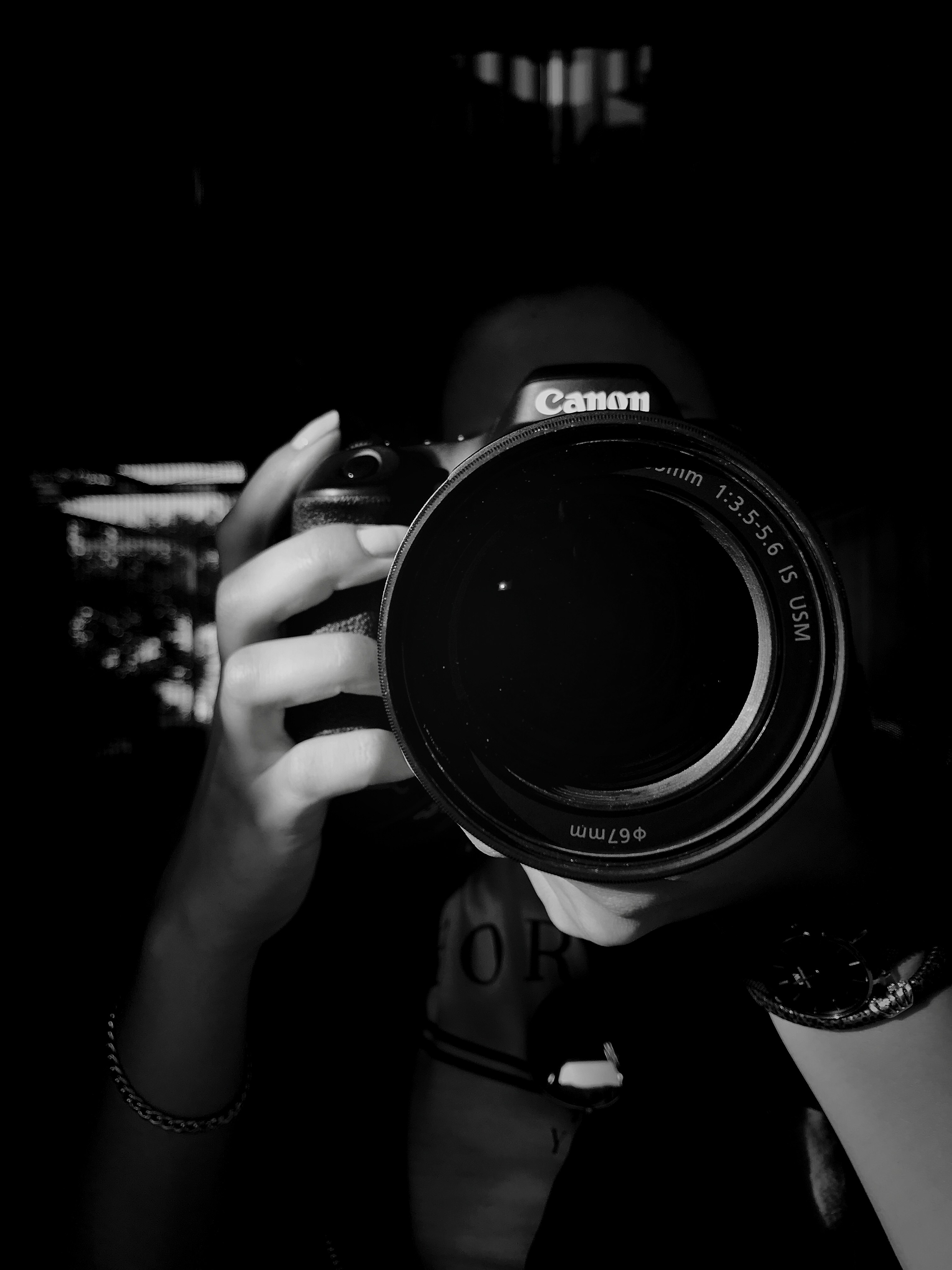 Grayscale photo of person holding Canon DSLR photo – Free Grey Image on ...
