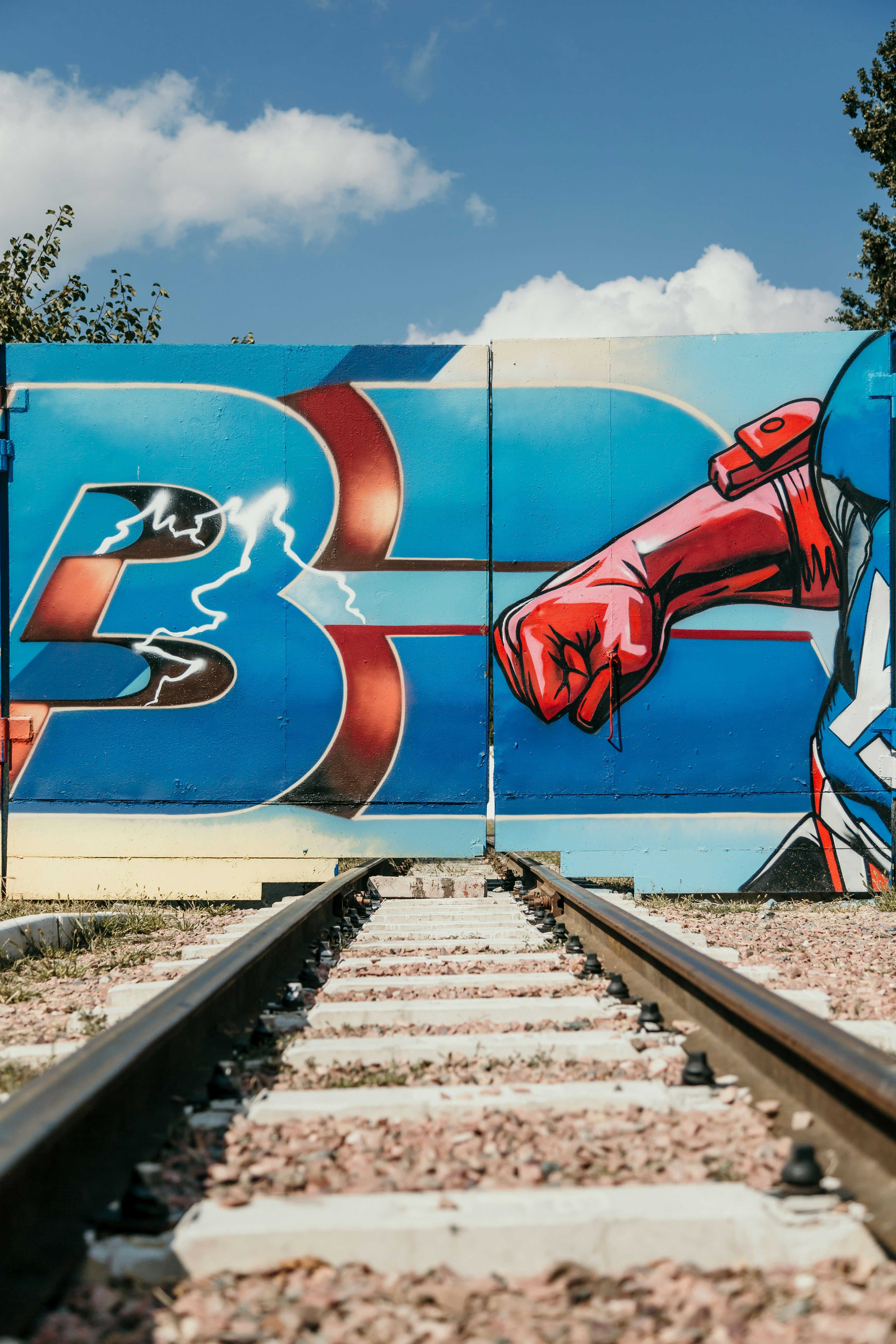 A train track with graffiti on the side of it photo – Free Киев Image ...