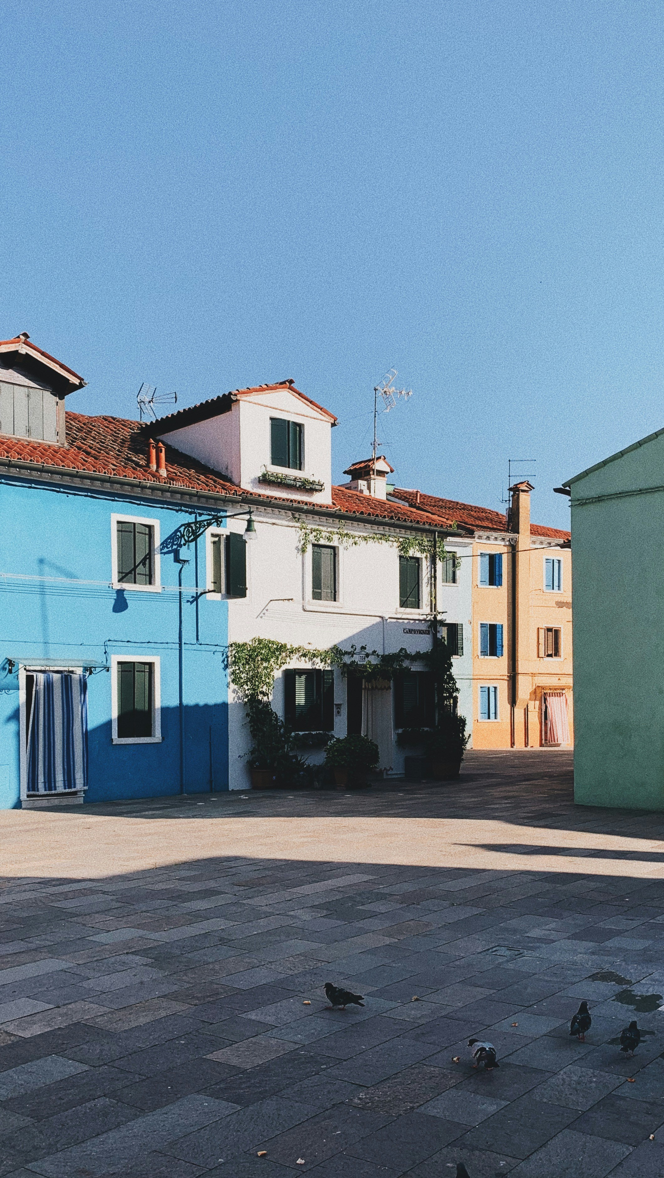 Pastel Facades in a Sunlit Square
