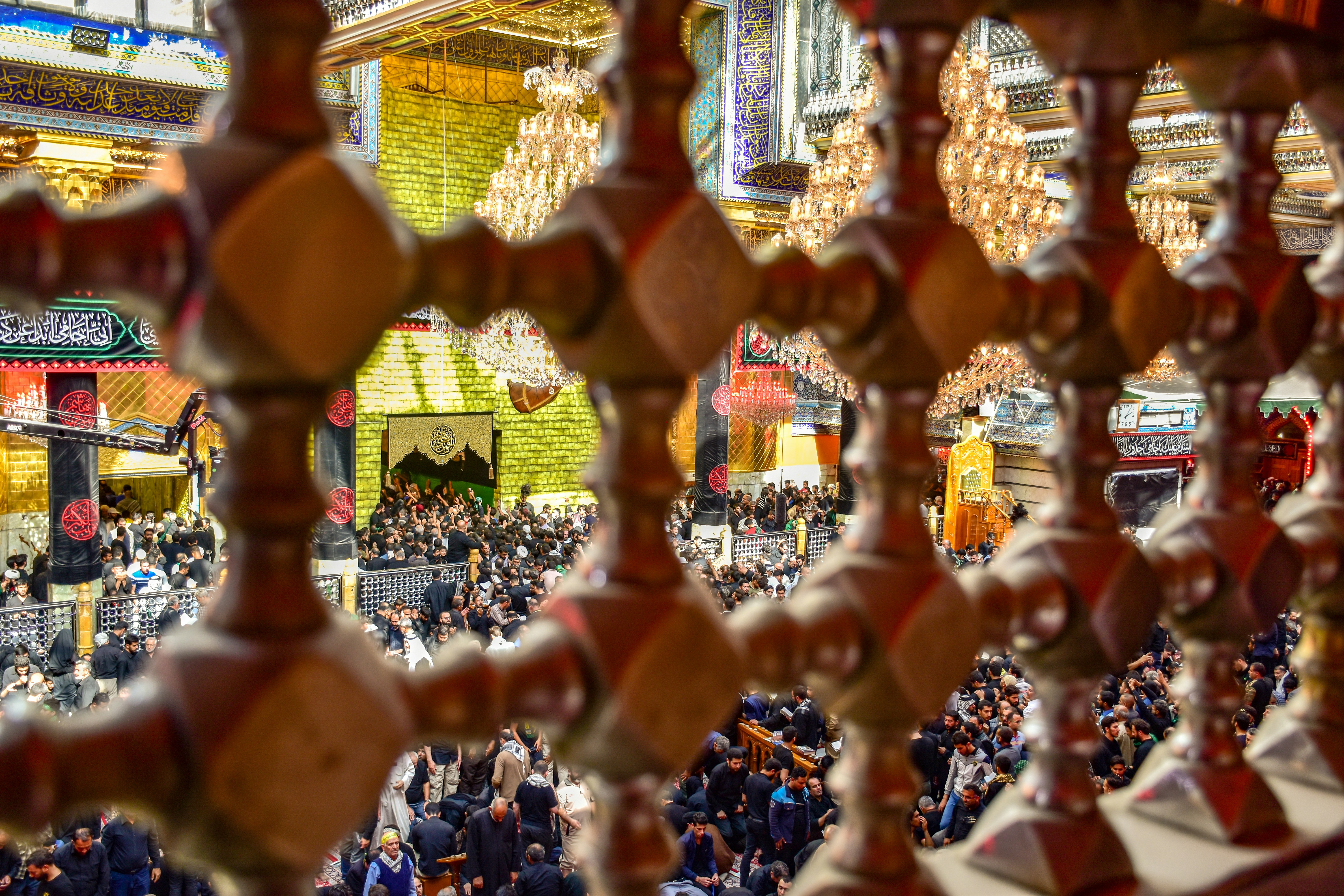 Lattice Framing a Gilded Sanctuary: A Crowd in Golden Light