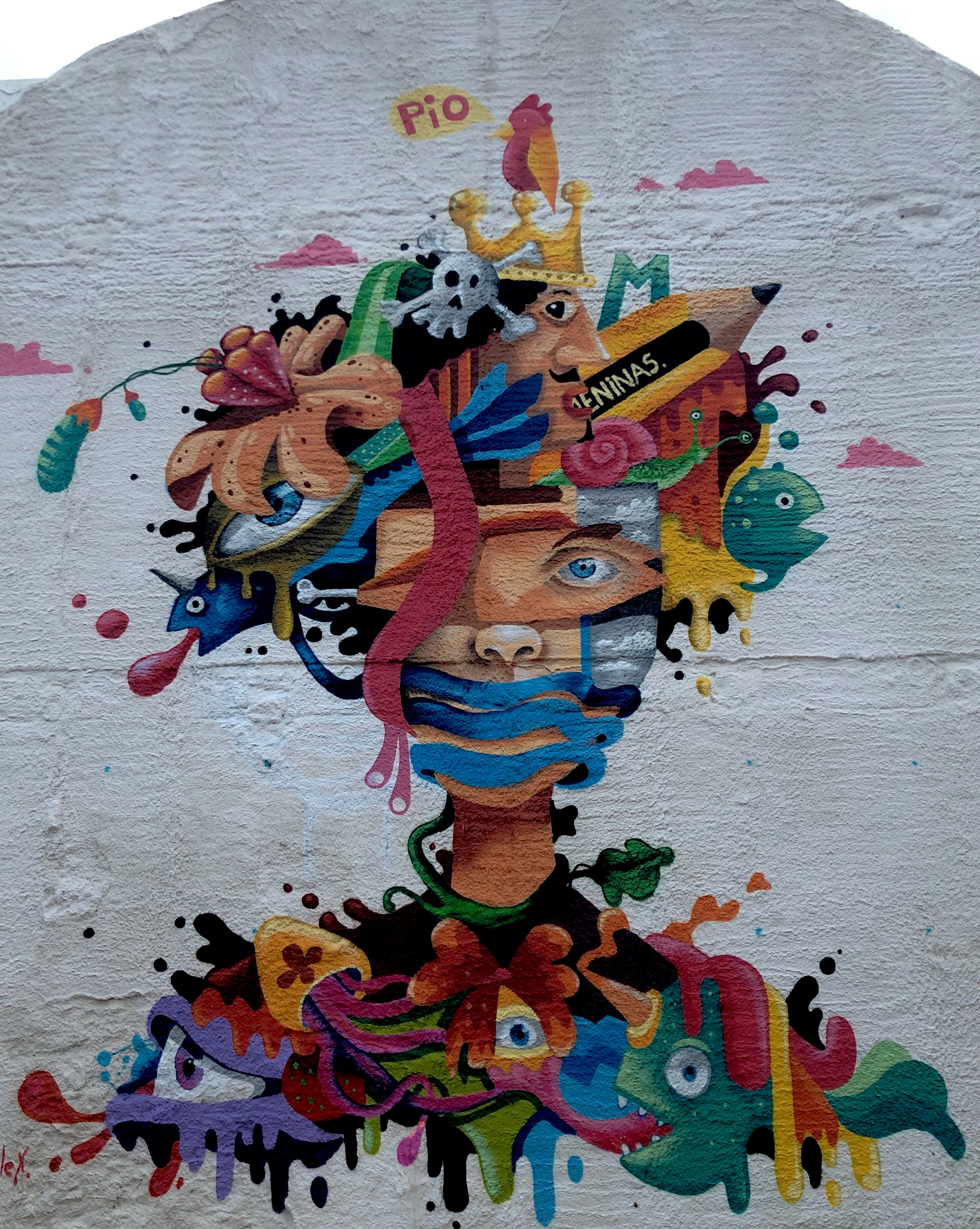 Kaleidoscopic Head: A Graffiti Mosaic of Emotion on Concrete
