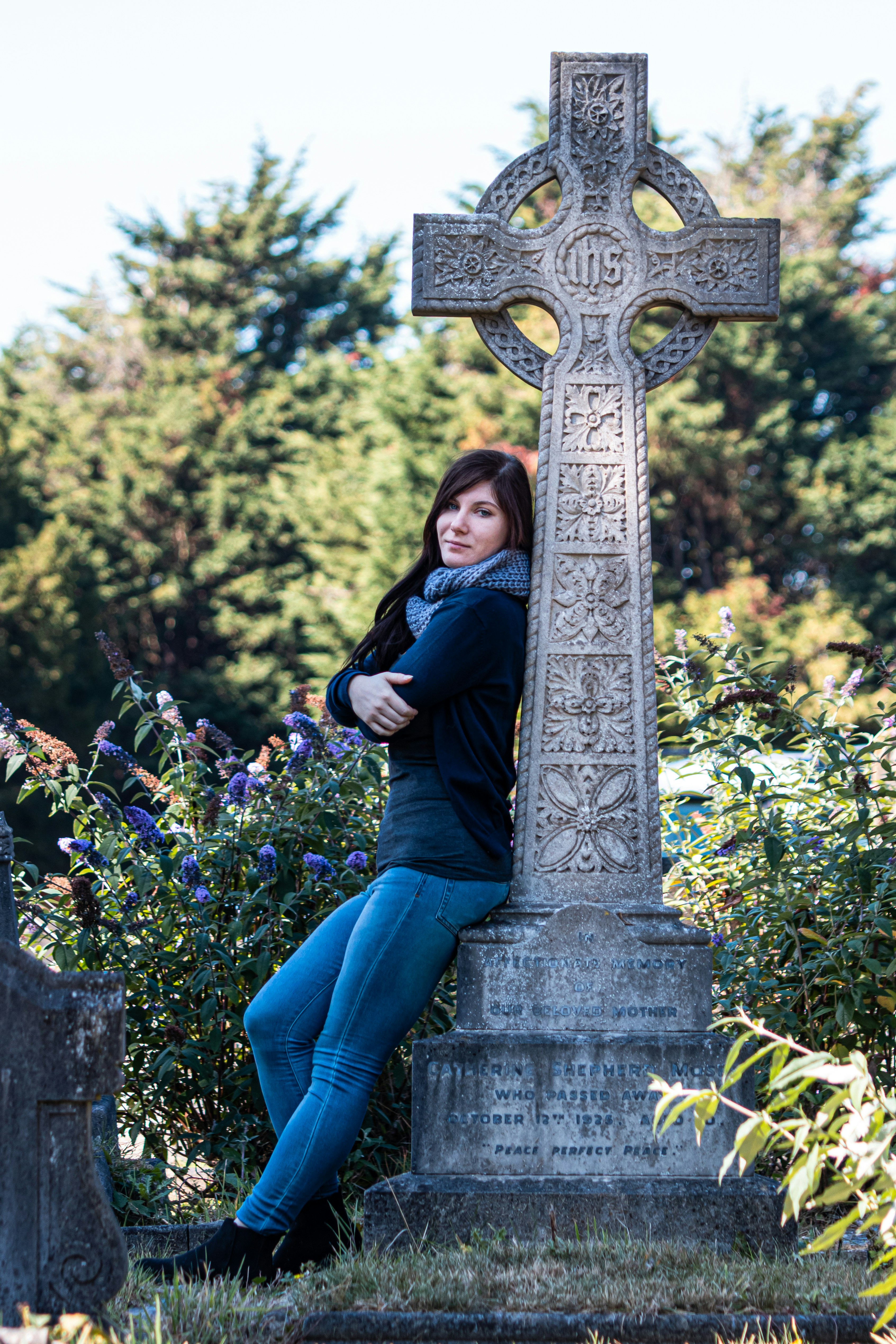 Woman leaning on cross photo – Free Cross Image on Unsplash