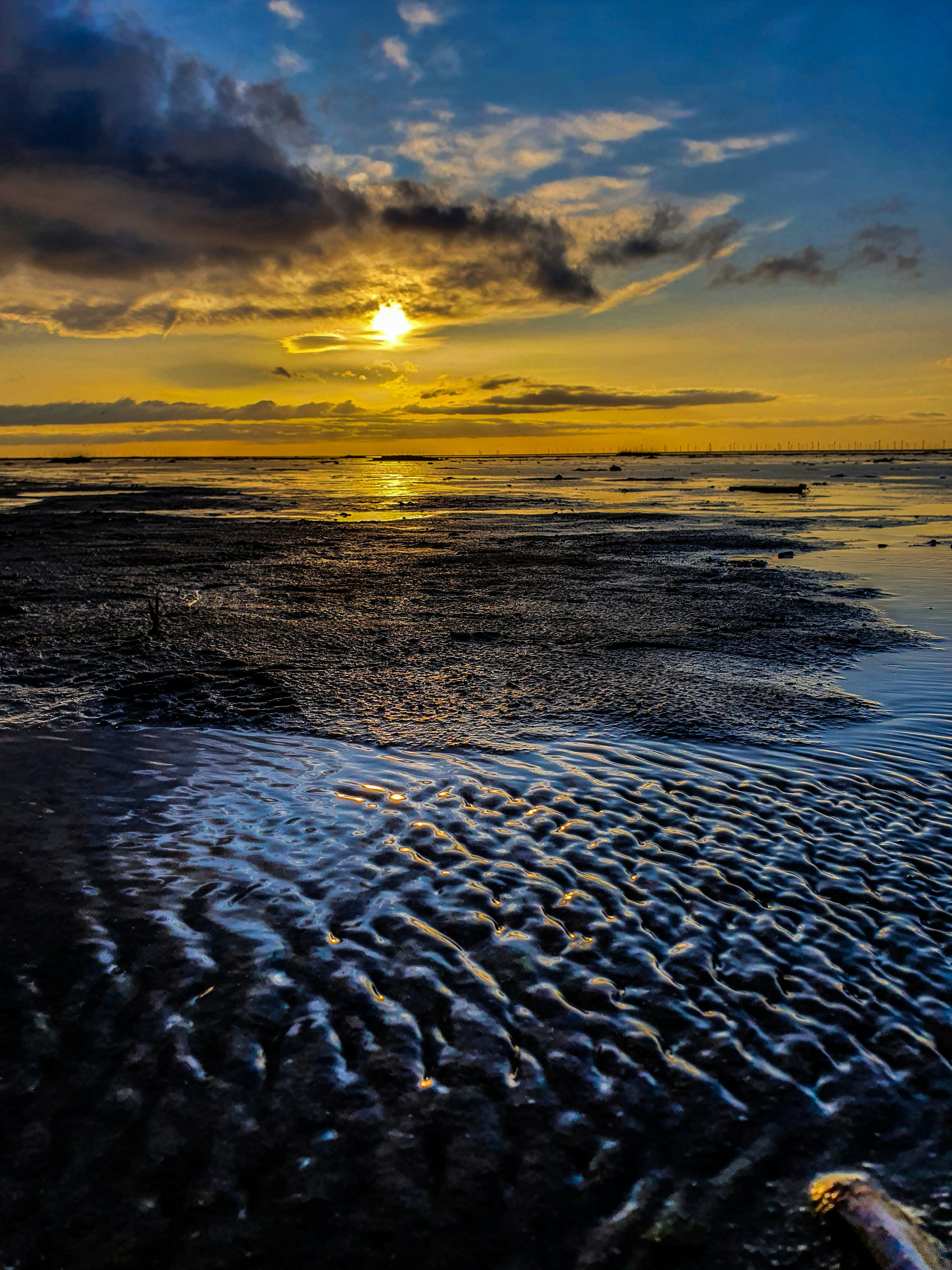 Sunlit Tide: Low Tide Patterns at Golden Hour