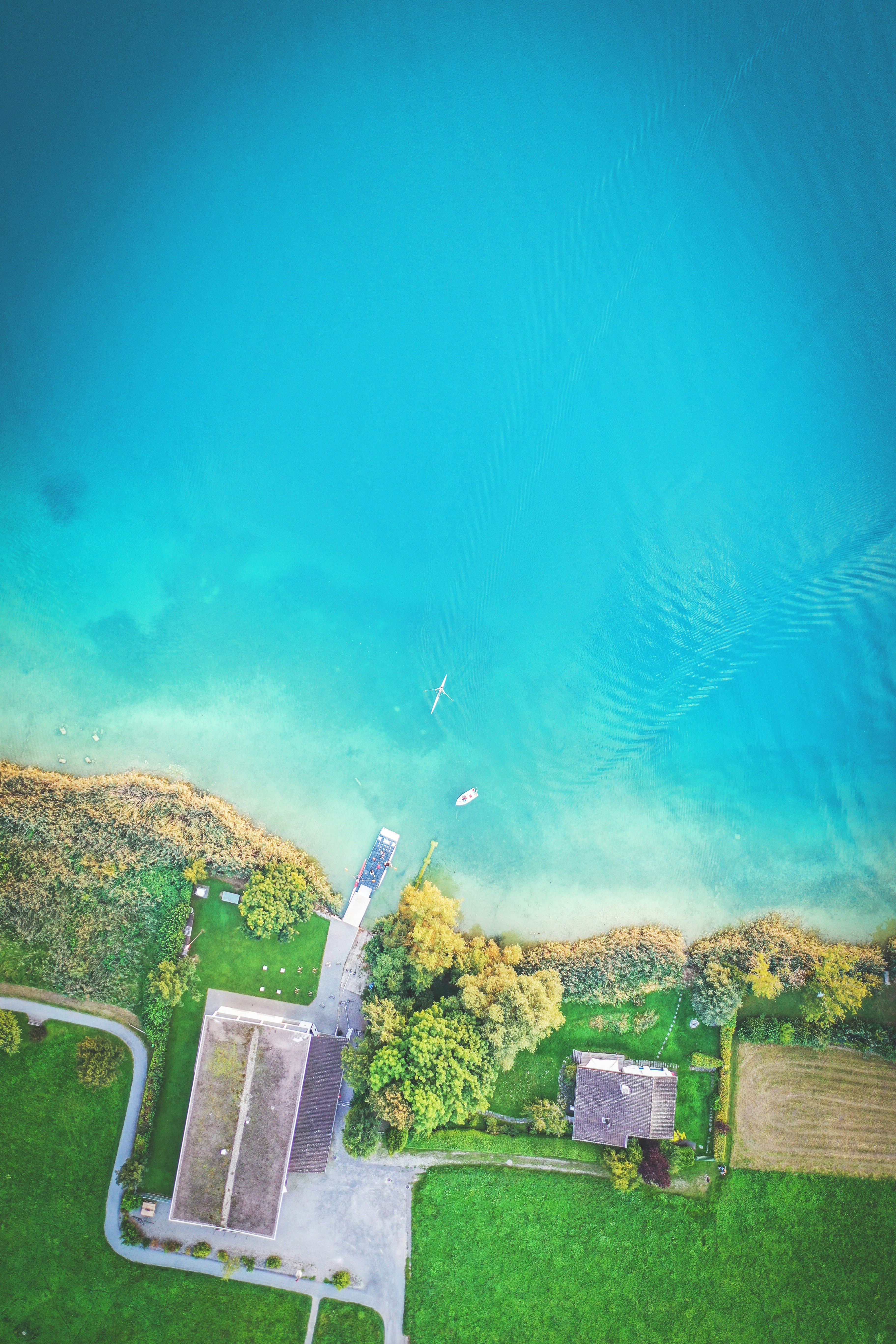 Lighthouse of Green and Blue: A Drone's Quiet Coastline