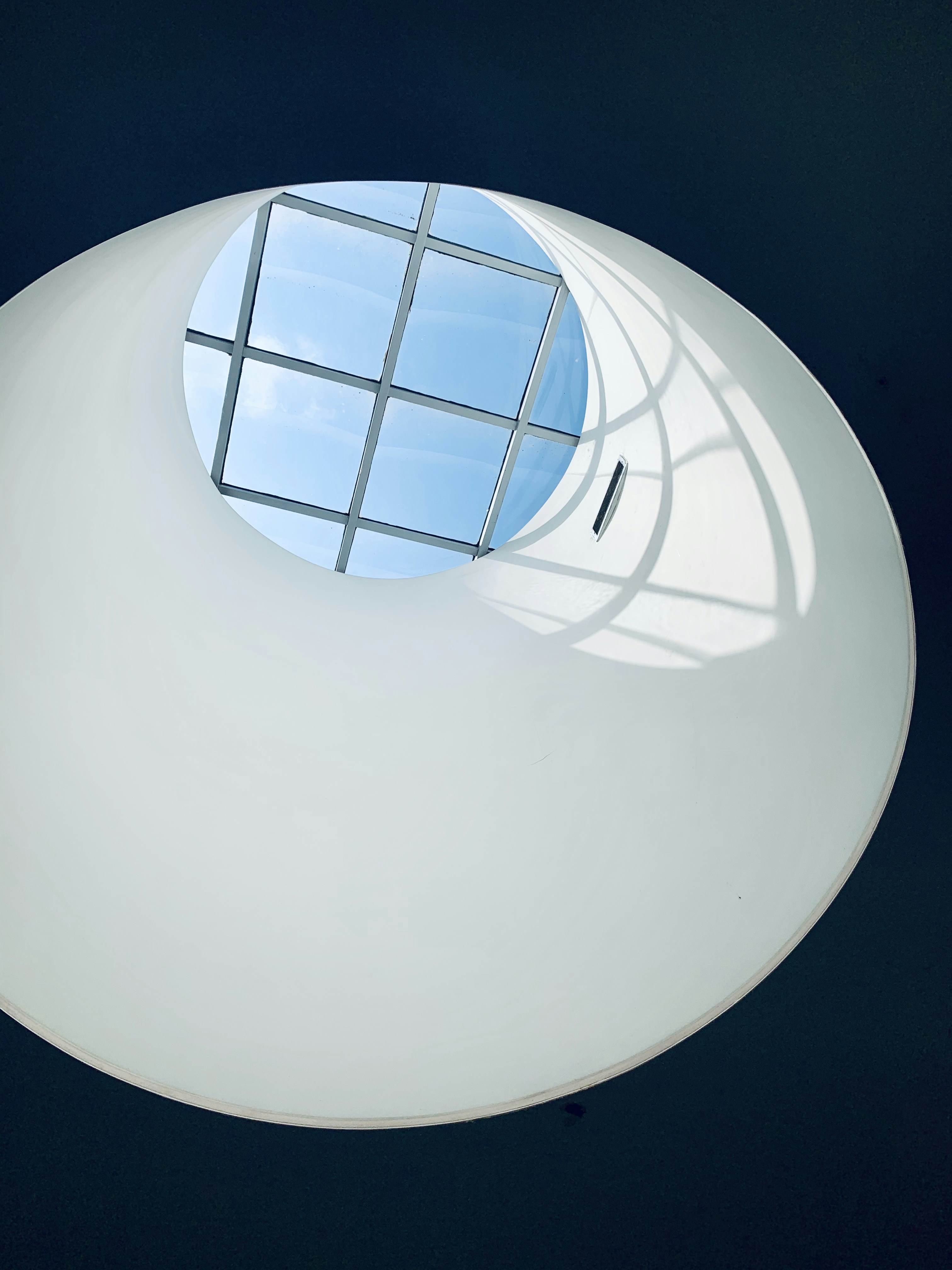 a round window in the ceiling of a building