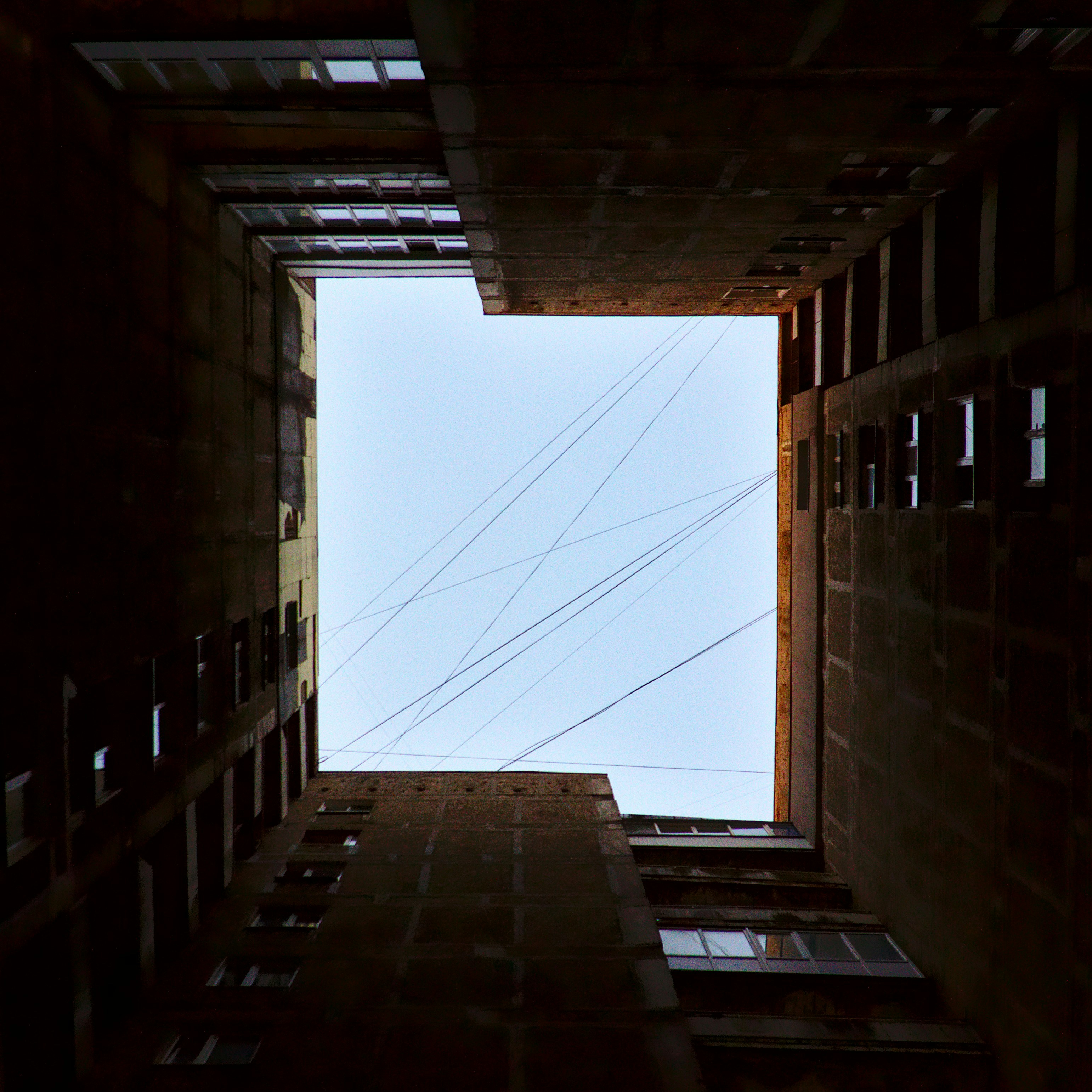 Open Atrium Overhead: A Skyframe Between Brick Towers
