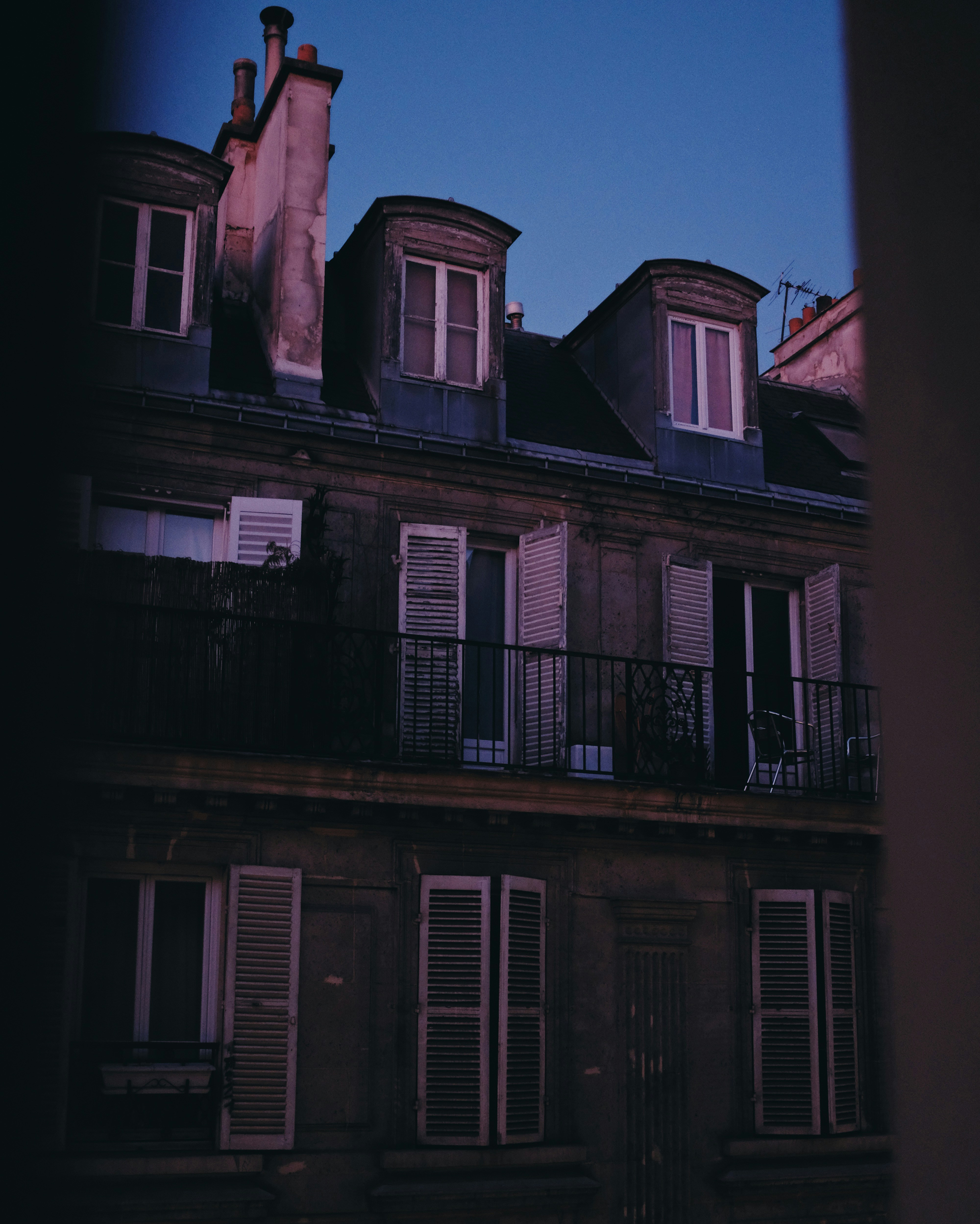 Twilight Windowrow: A Quiet Balcony Under European Rooftops