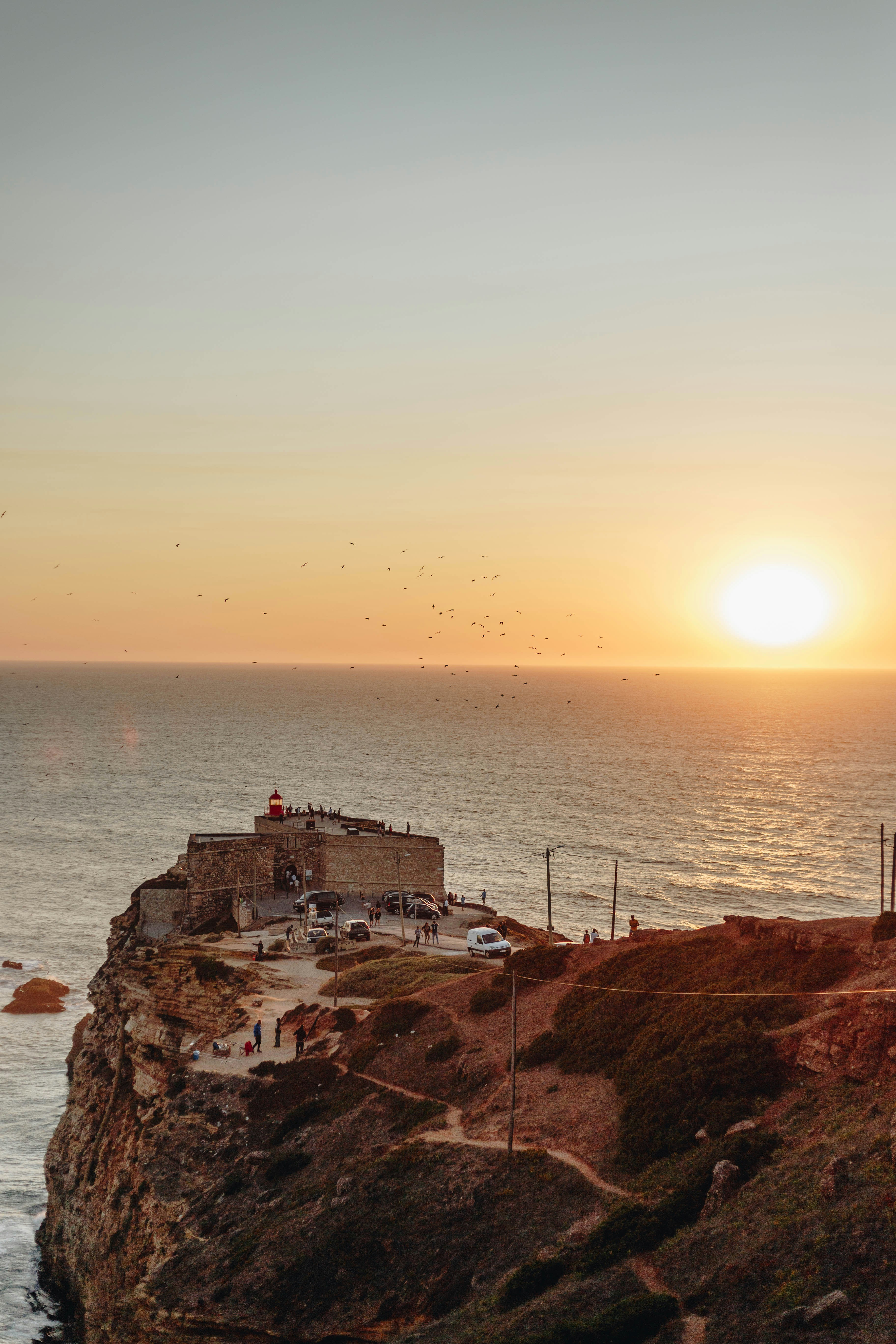 Gray concrete building near calm water at daytime photo – Free Grey ...