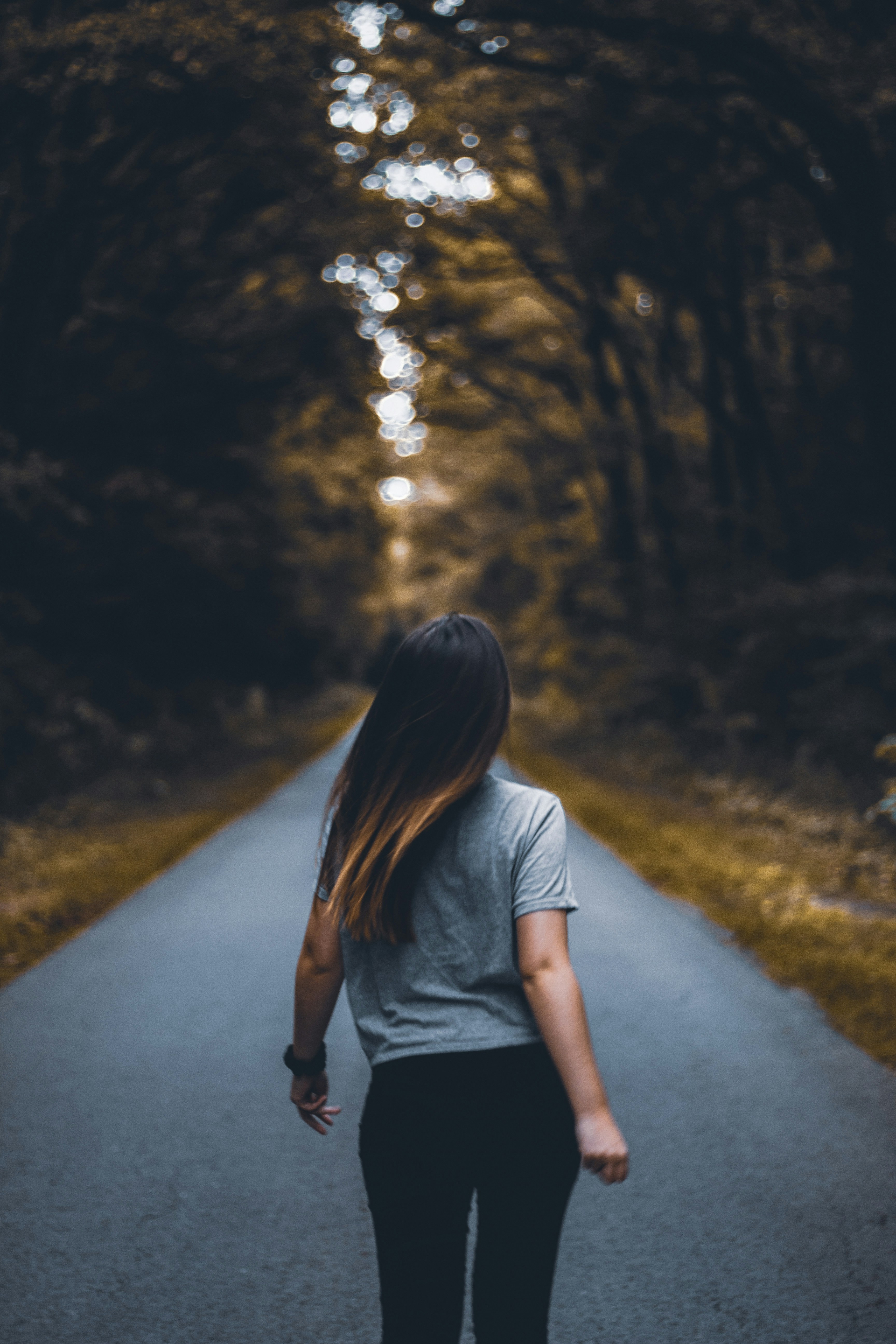 Sad Girl Walking Down A Road