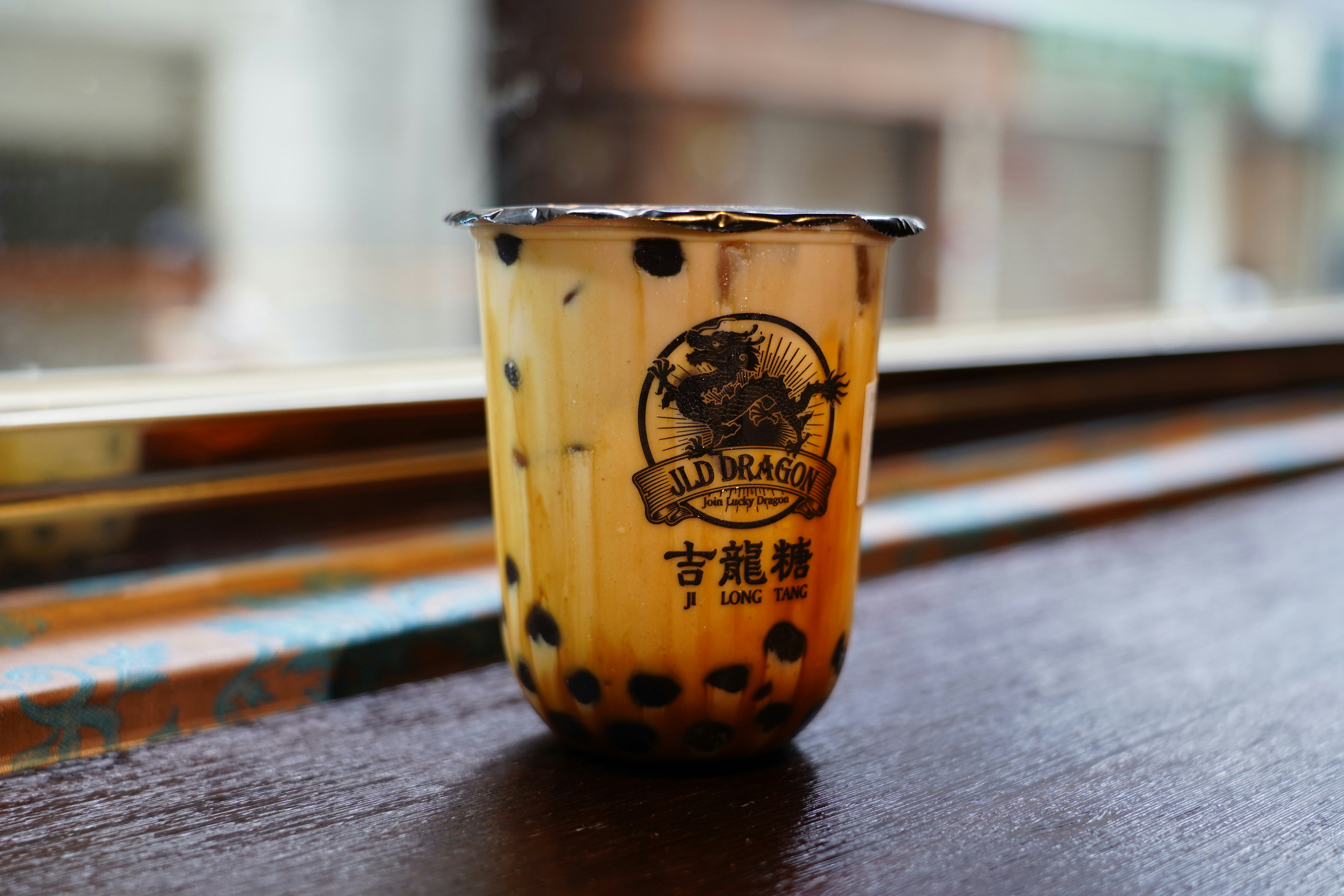 Golden Pearl Milk Tea in a Rustic Café Glow