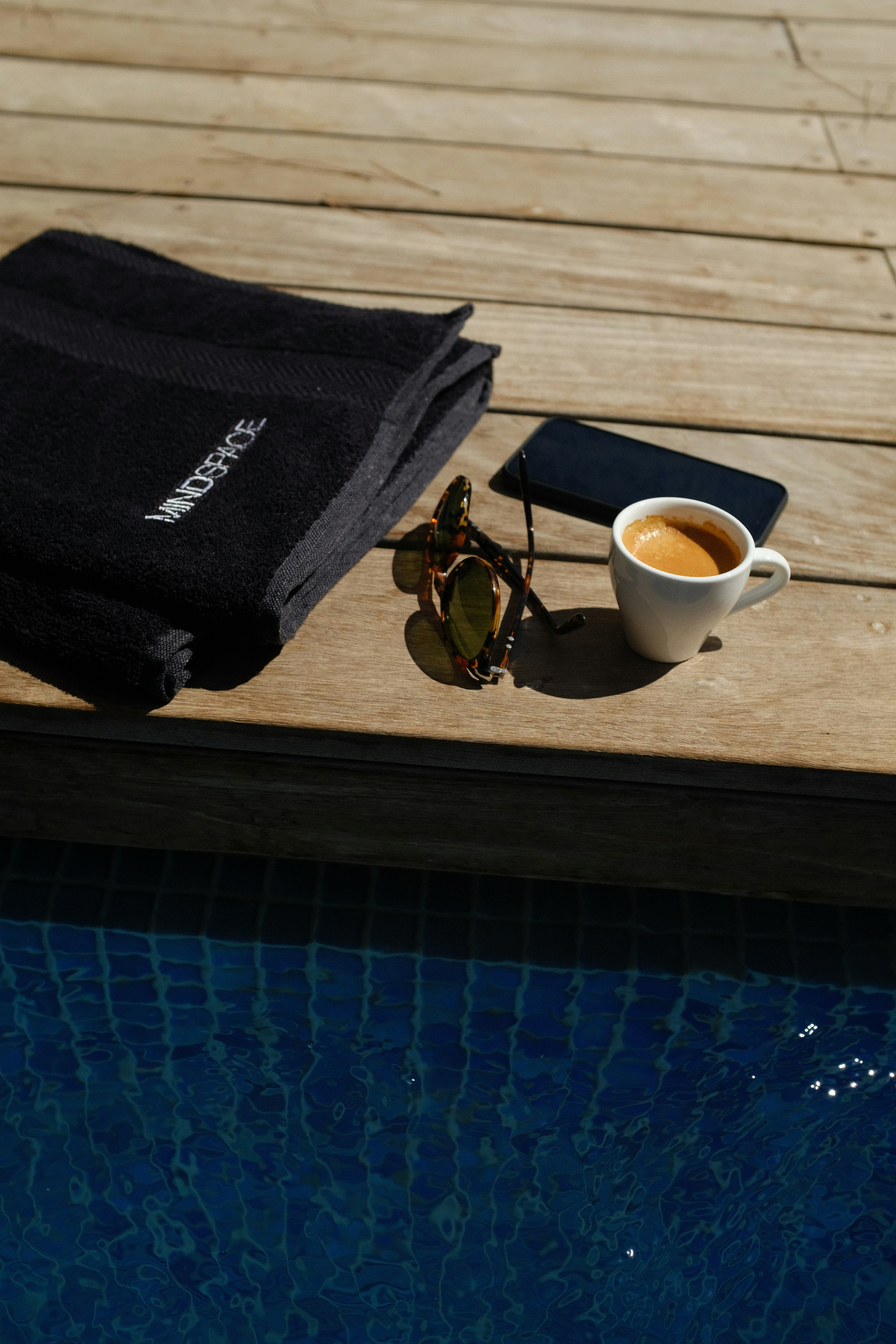 Morning by the Deck: Espresso, Sunglasses, and Reflections