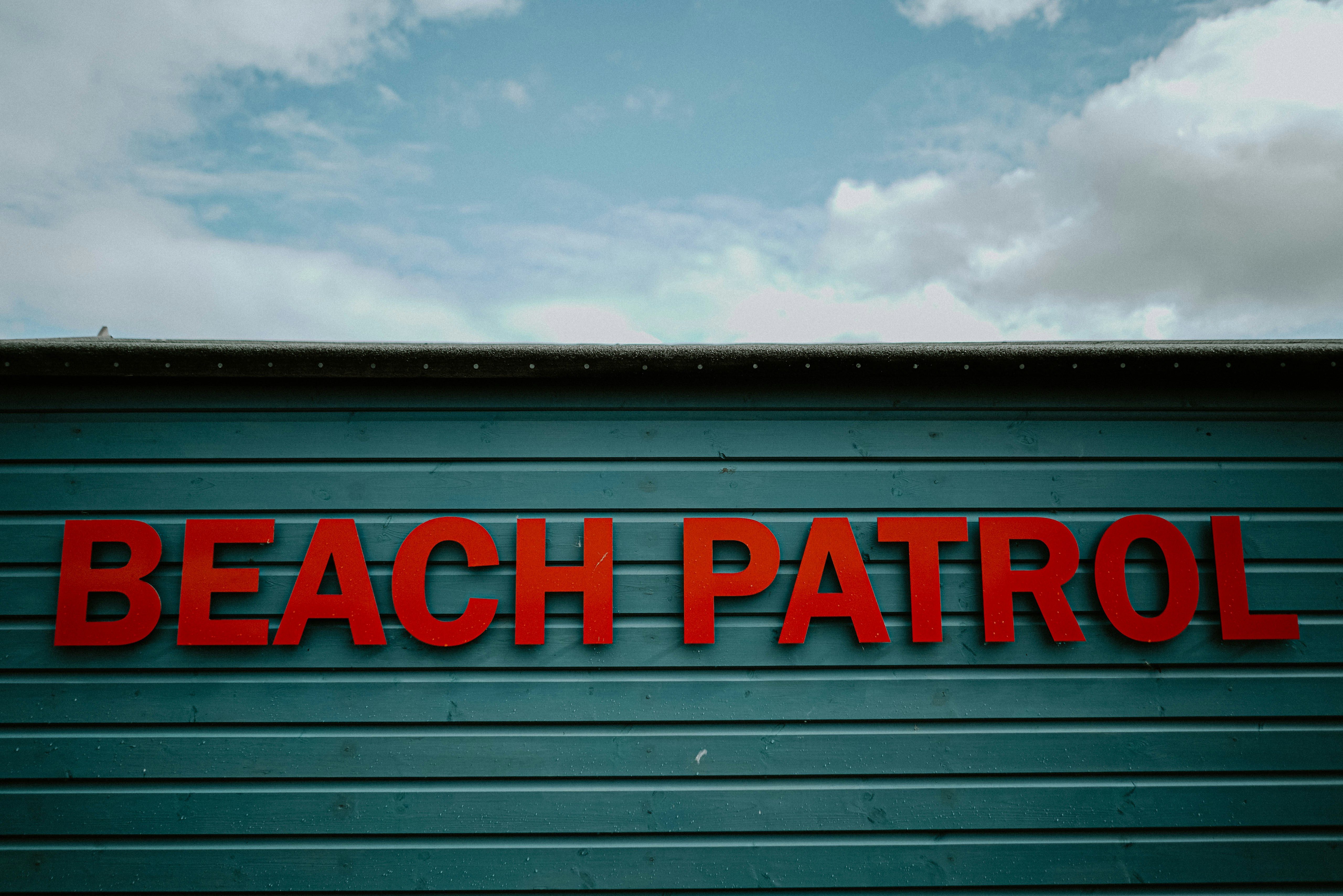 Beach Patrol signage photo – Free Red Image on Unsplash