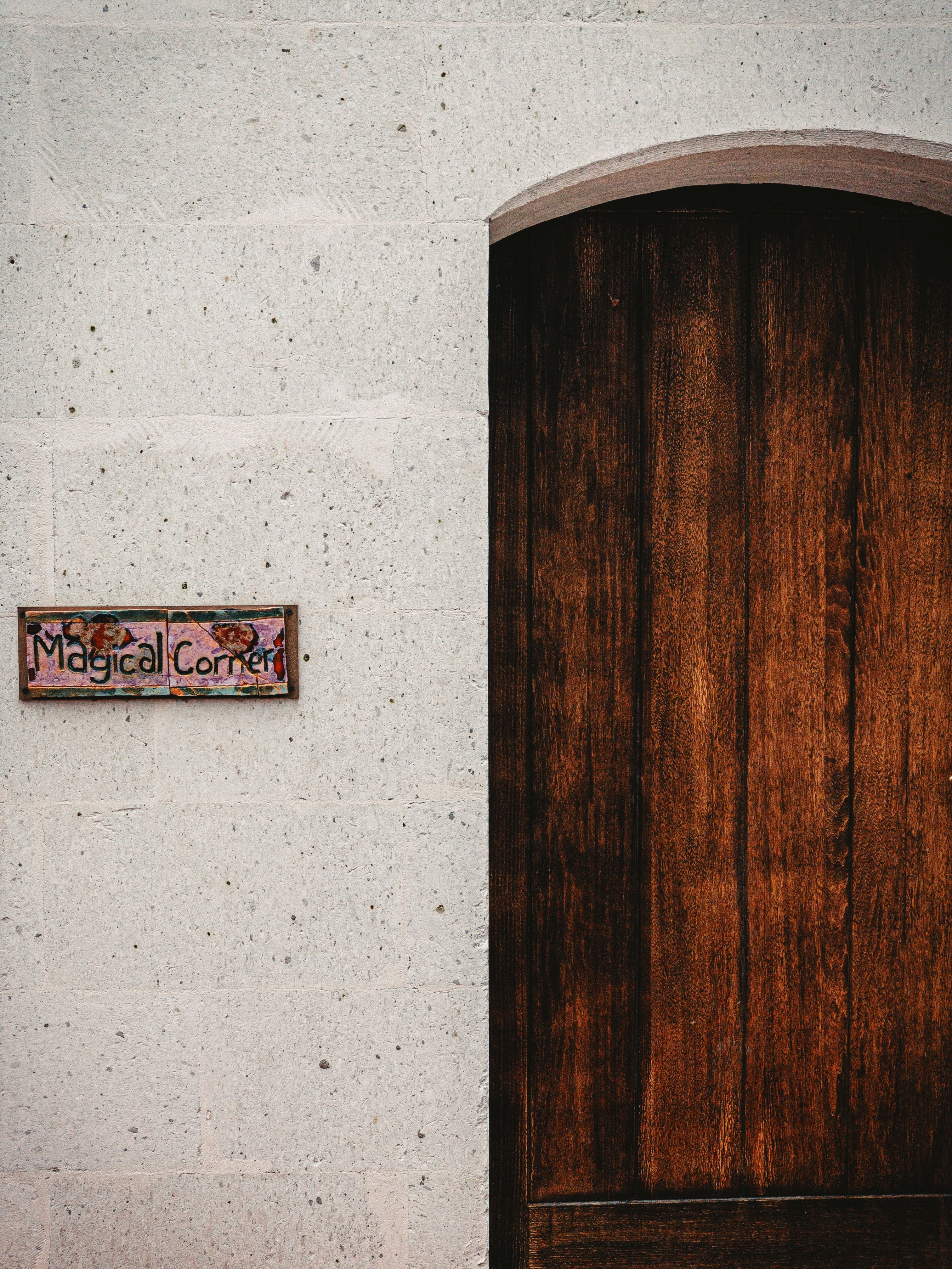 Magical Corner: Weathered Door and a Playful Sign