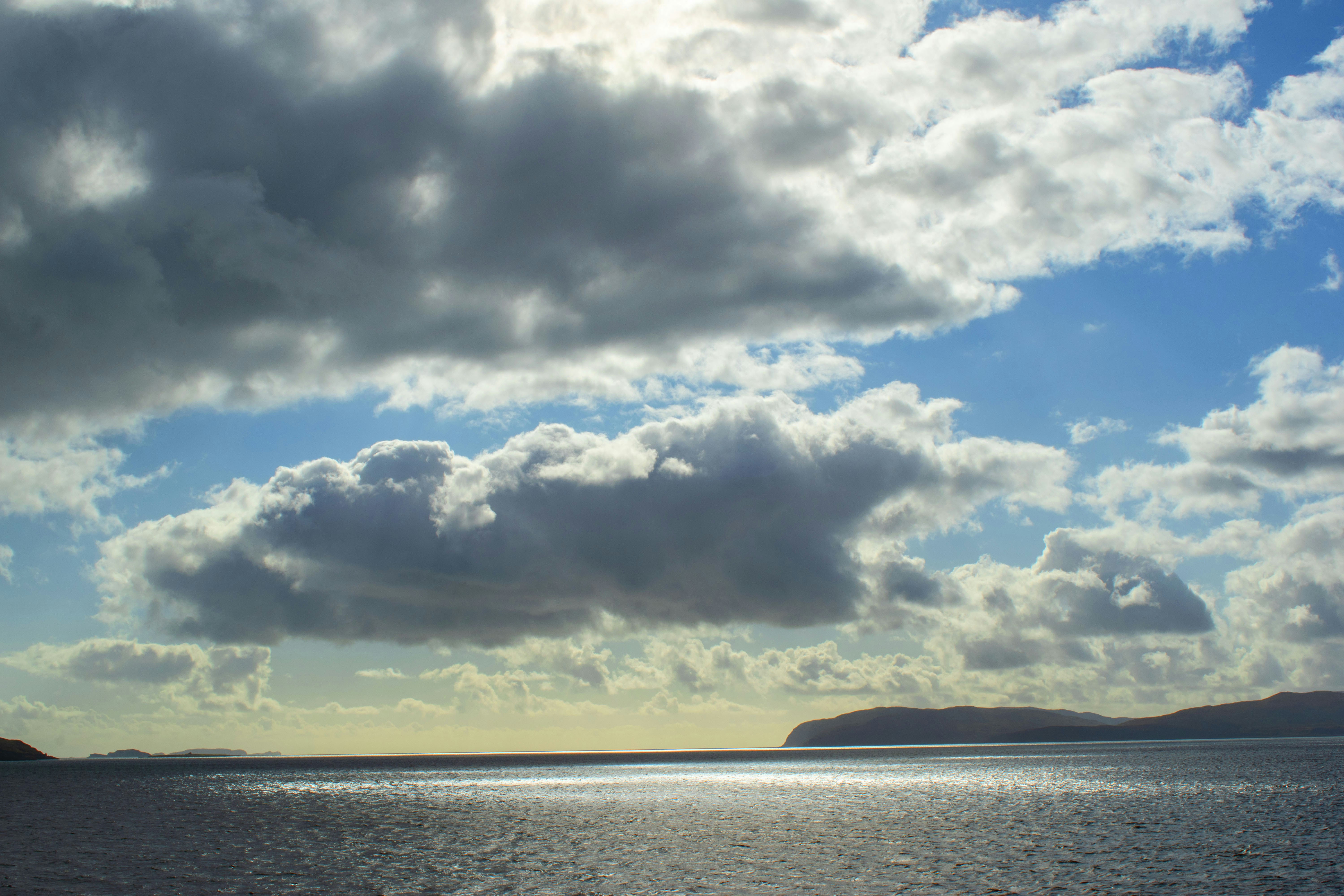 Body of water under cloudy sky during daytime photo – Free Grey Image ...