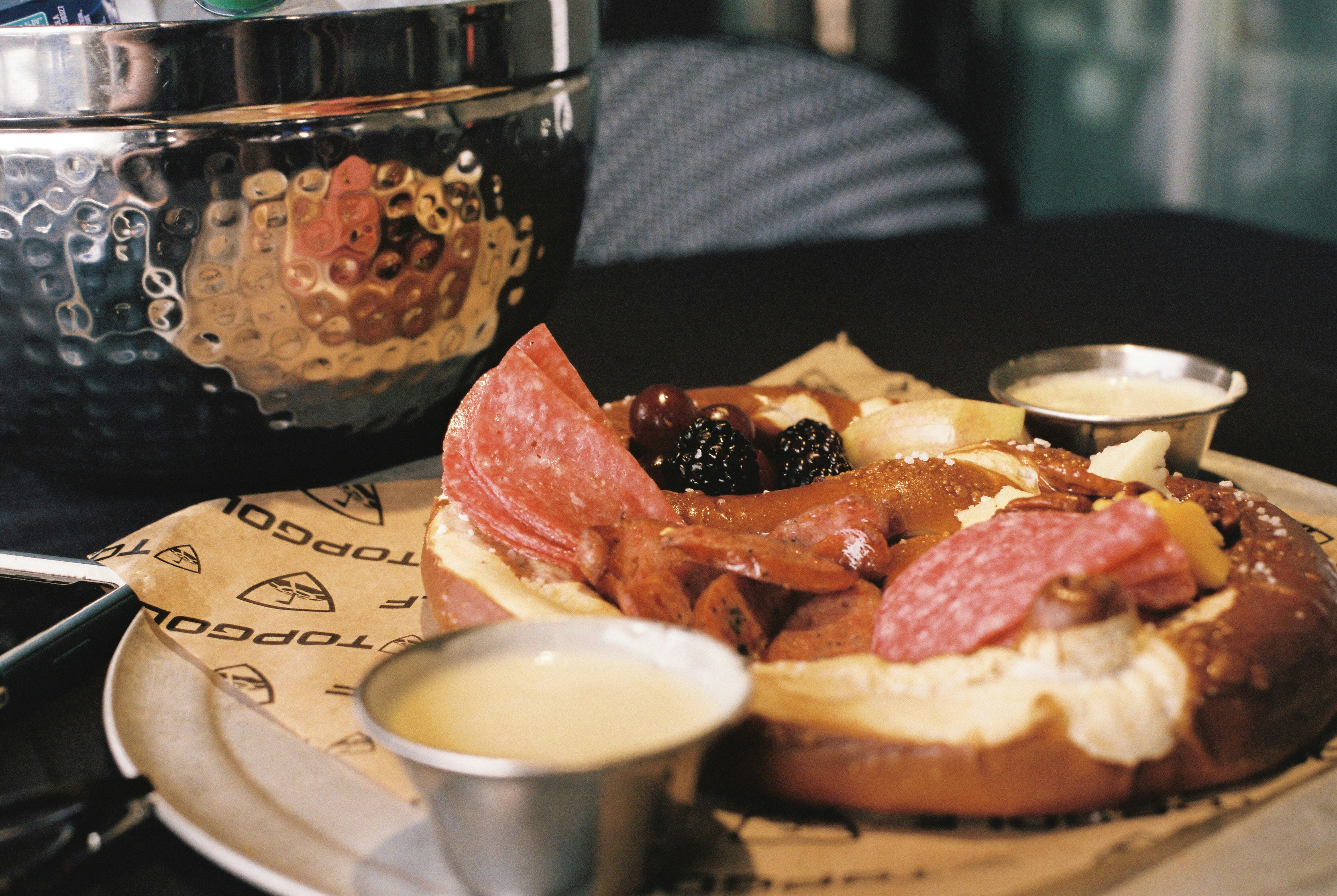 Caramel-kissed waffle with berry medley under cozy cafe glow