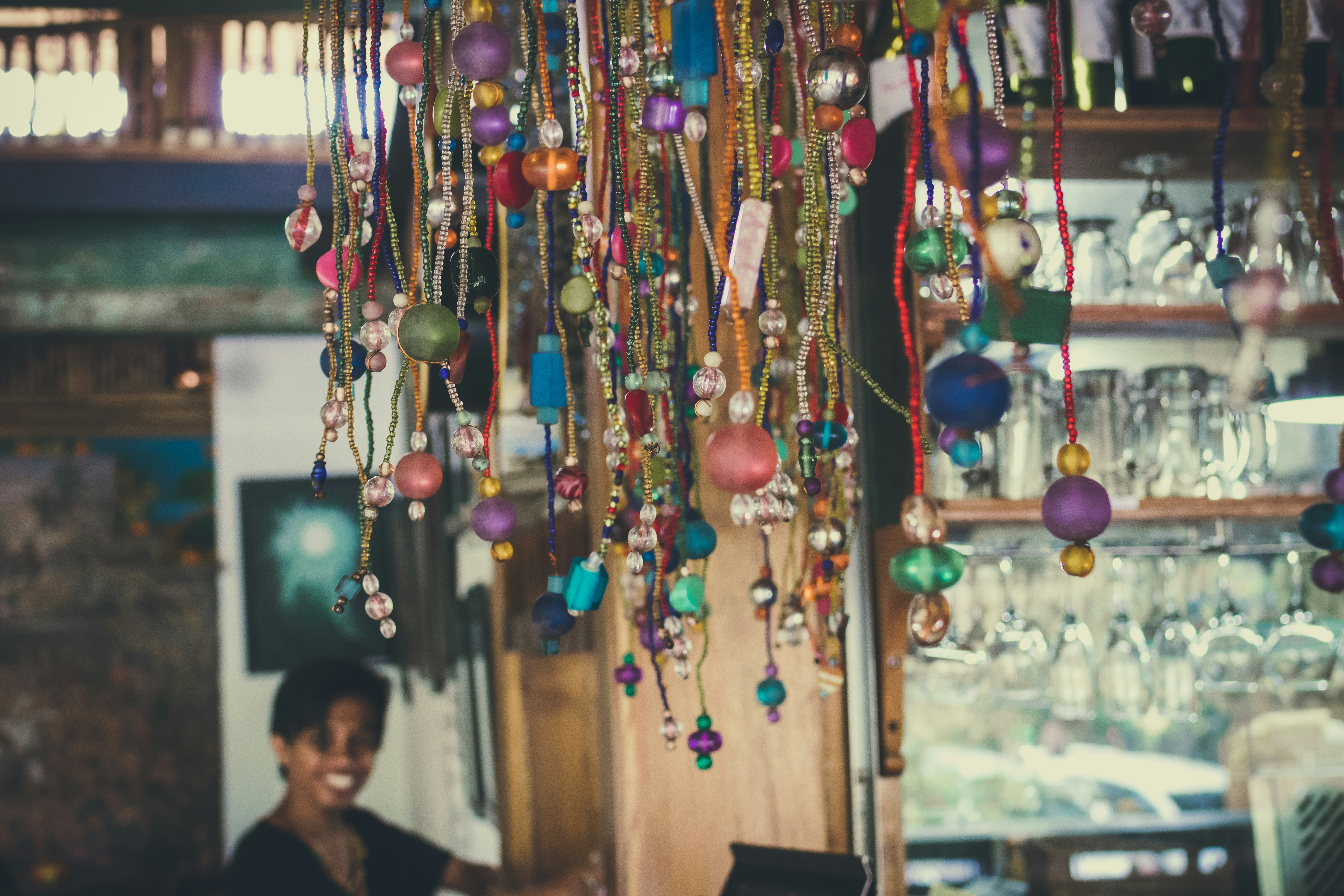 assorted accessories hanging across wine glasses