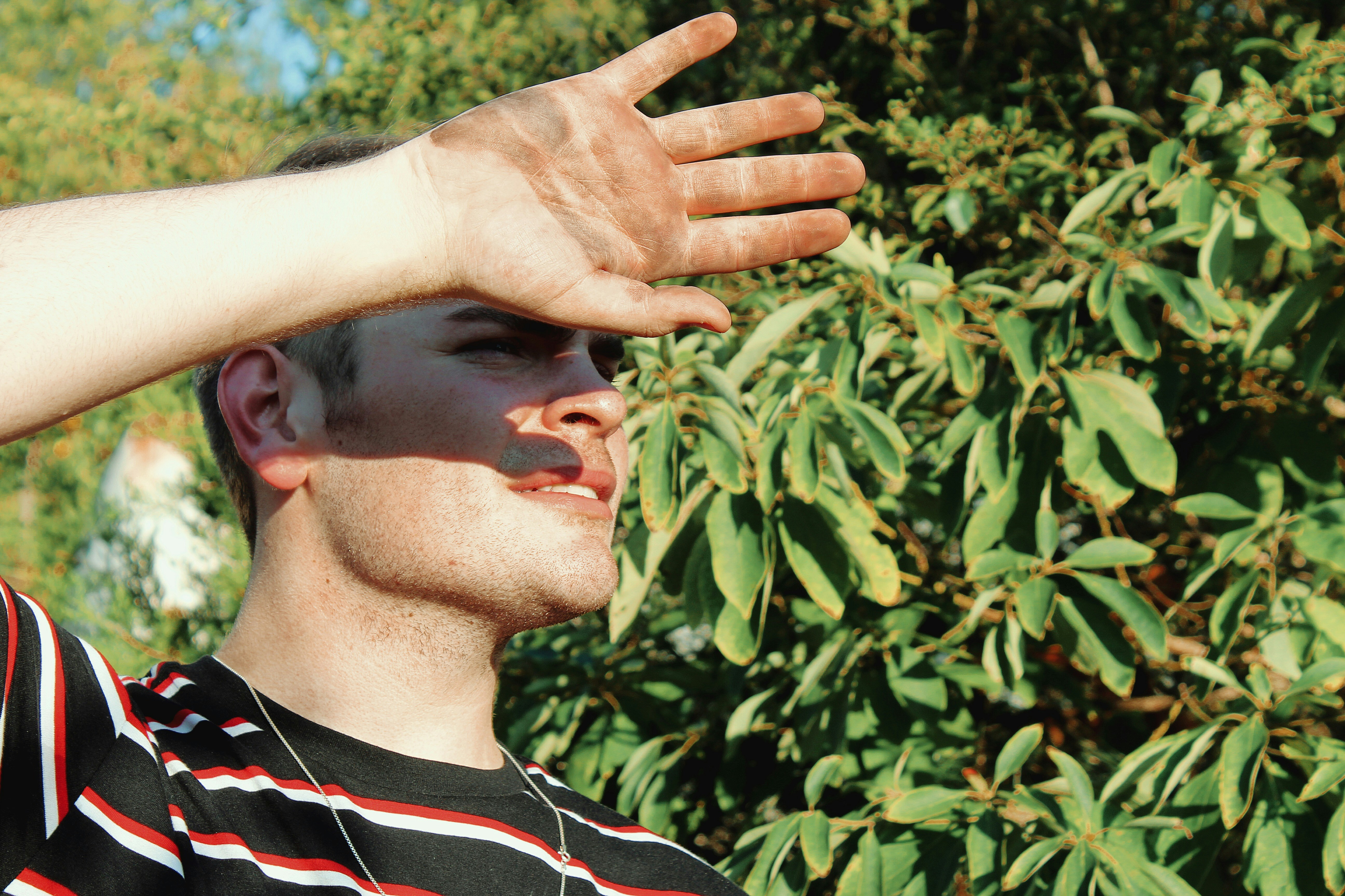 Man shielding his face with his right hand photo – Free Human Image on ...