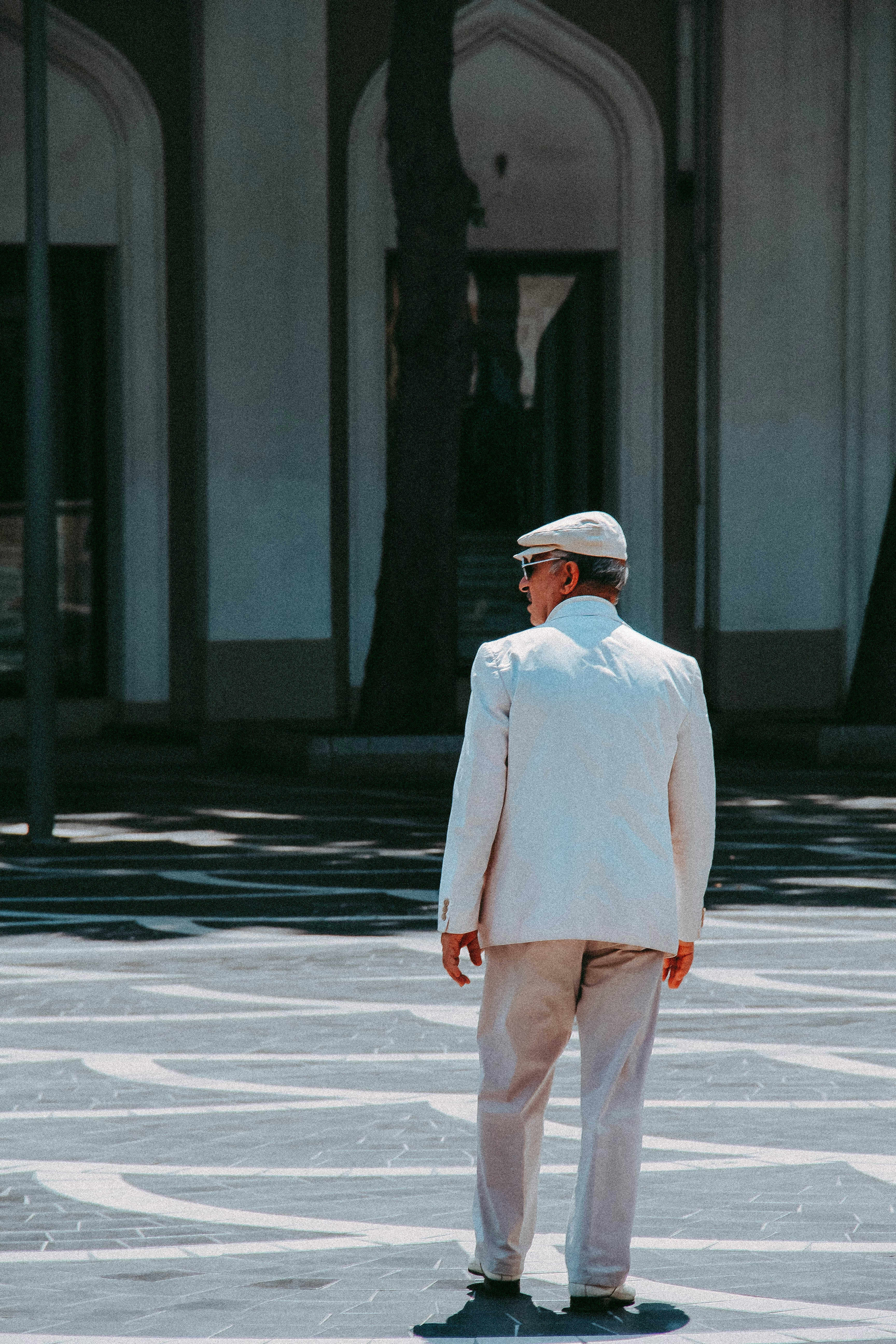 Man standing near building during day photo – Free Grey Image on Unsplash