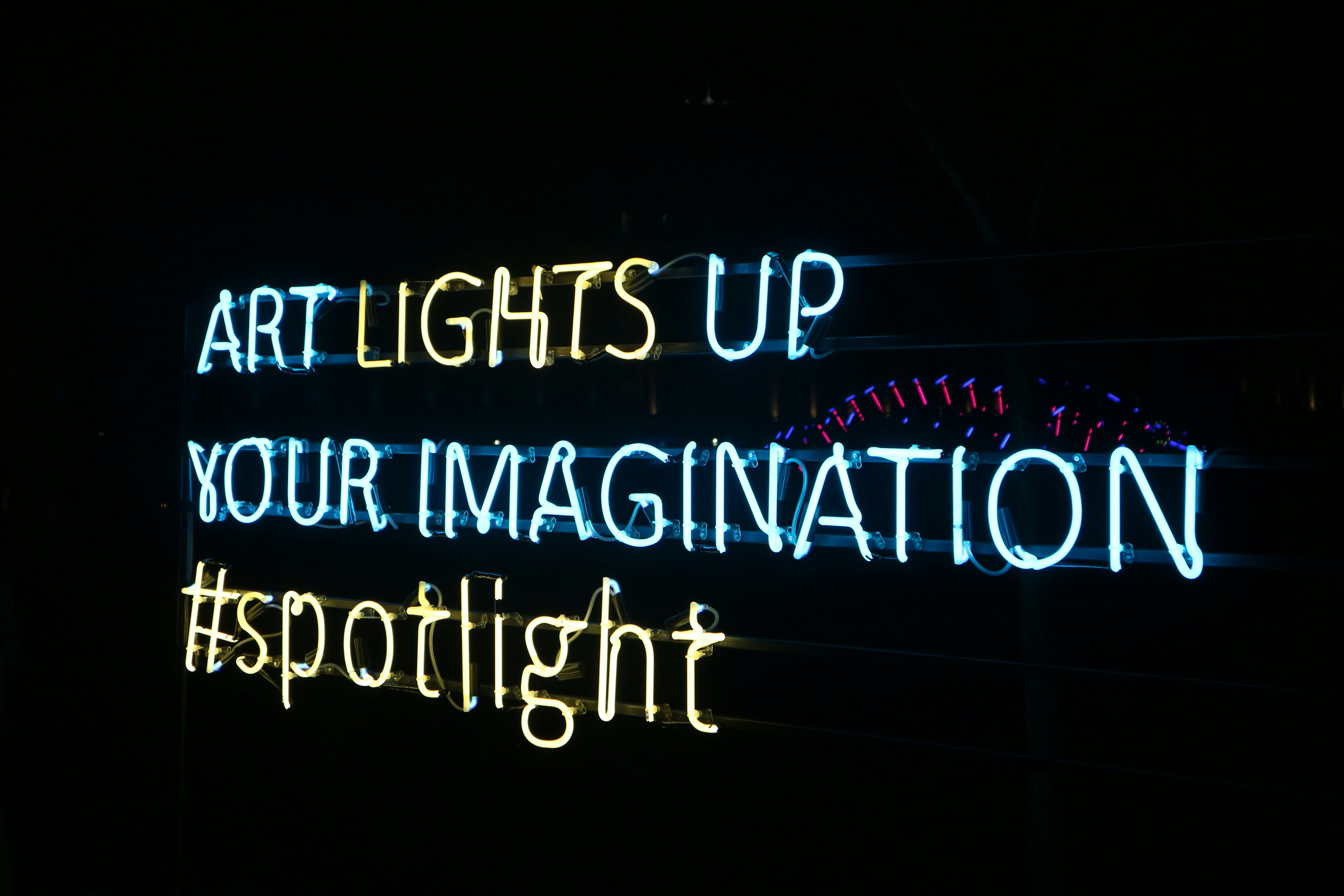 A neon sign that says art lights up your imagination spotlight photo ...