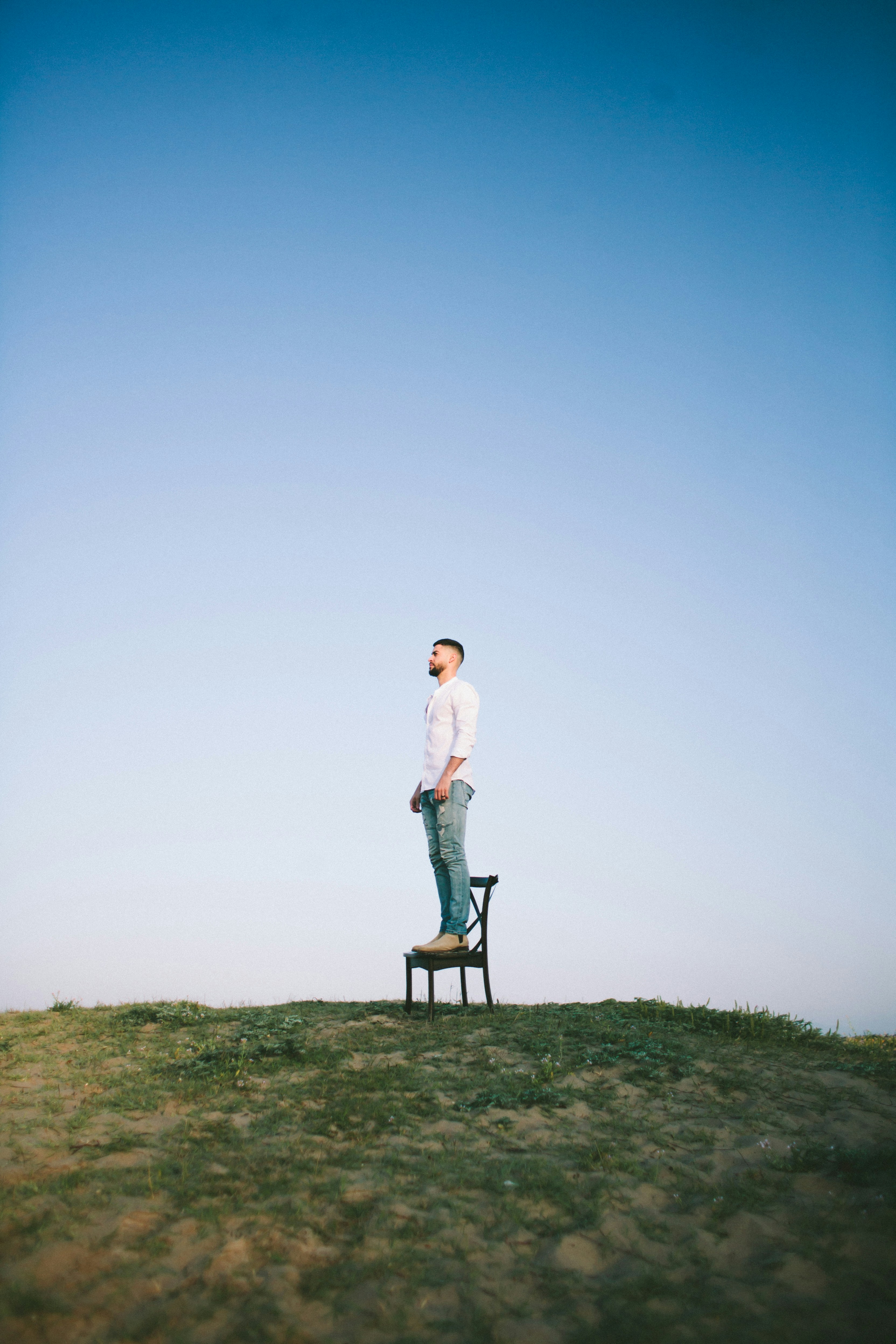 Man standing on chair photo – Free Nature Image on Unsplash