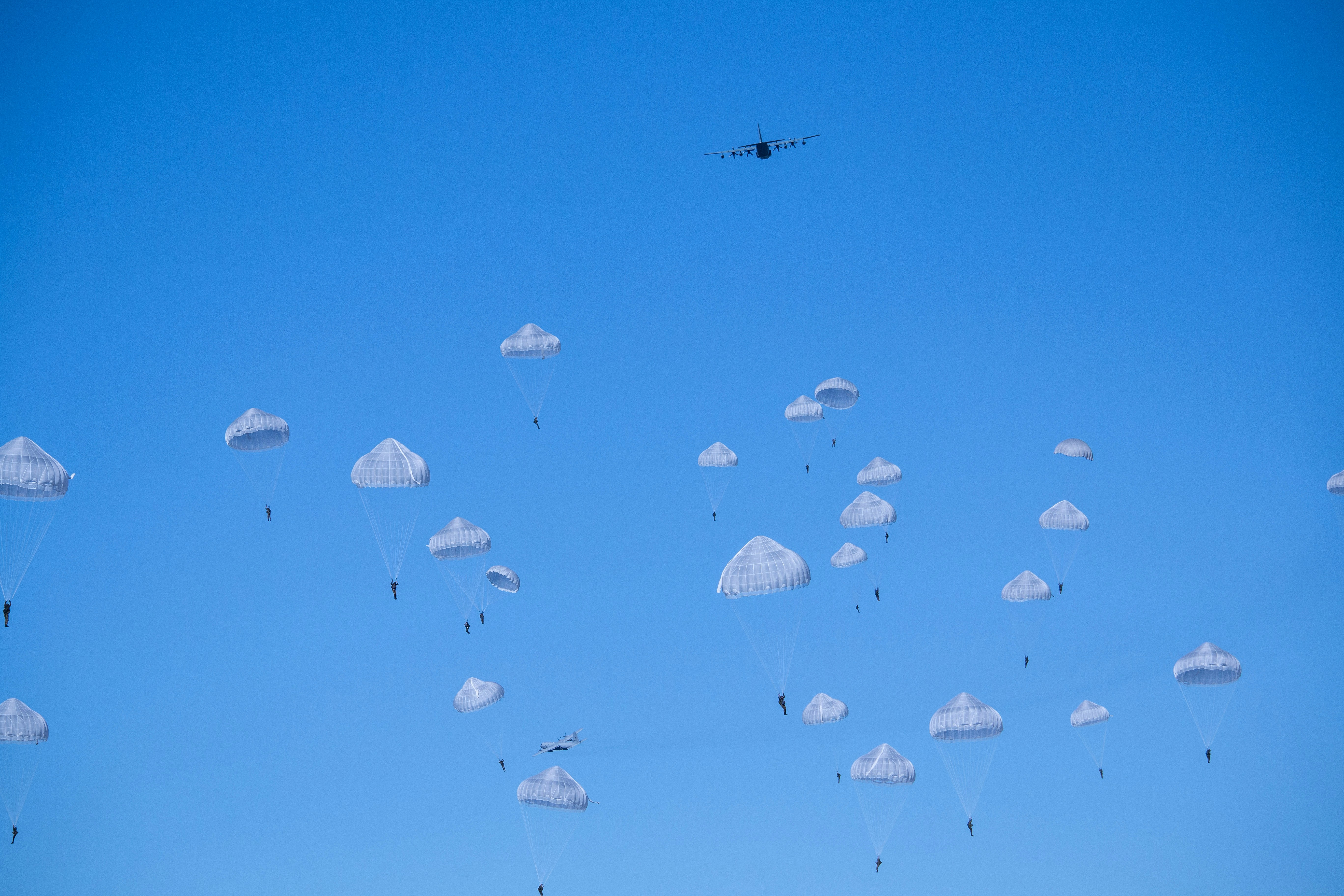 White parachutes during daytime photo photo – Free Blue Image on Unsplash