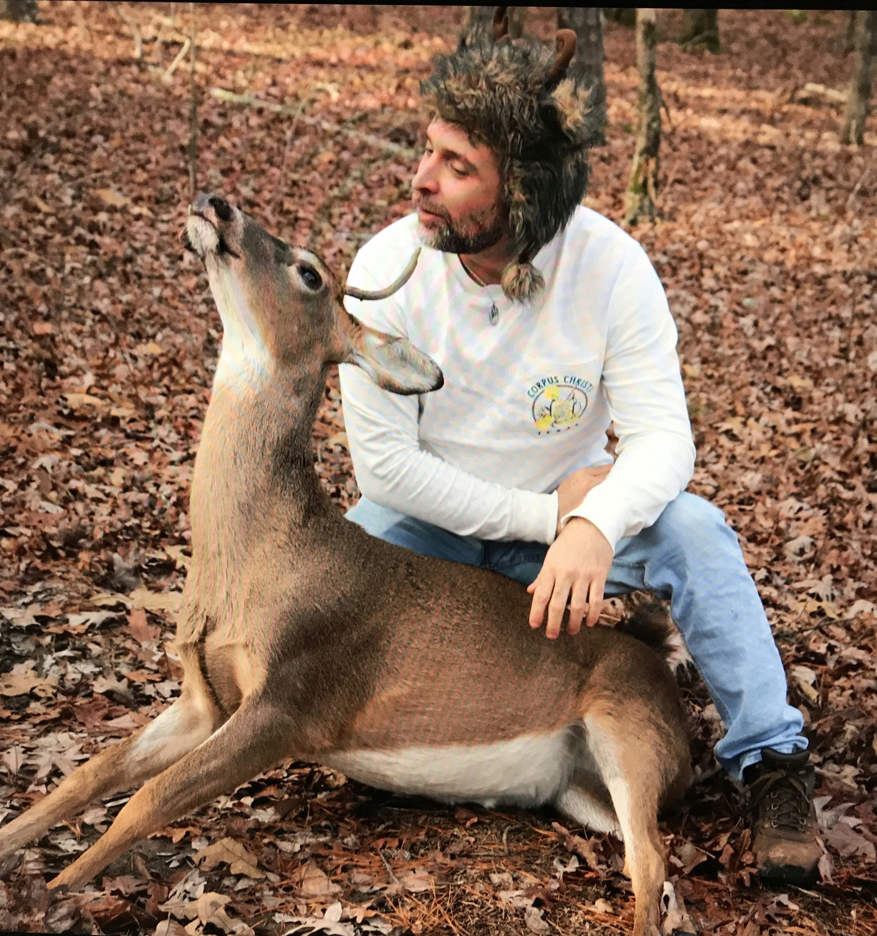 Autumn Accord: A Quiet Moment Between Man and Deer