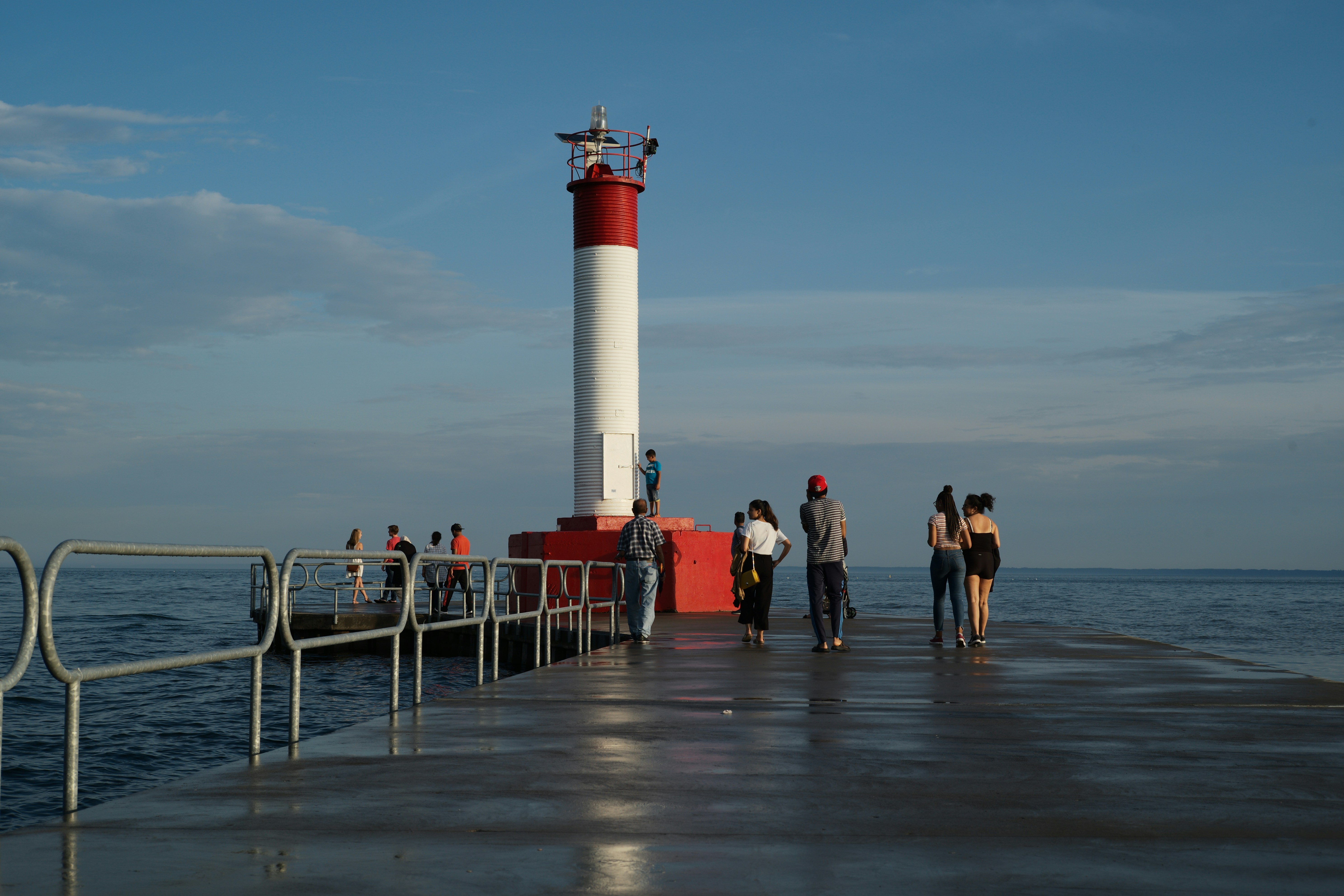 Red and white lighthouse photo – Free Human Image on Unsplash