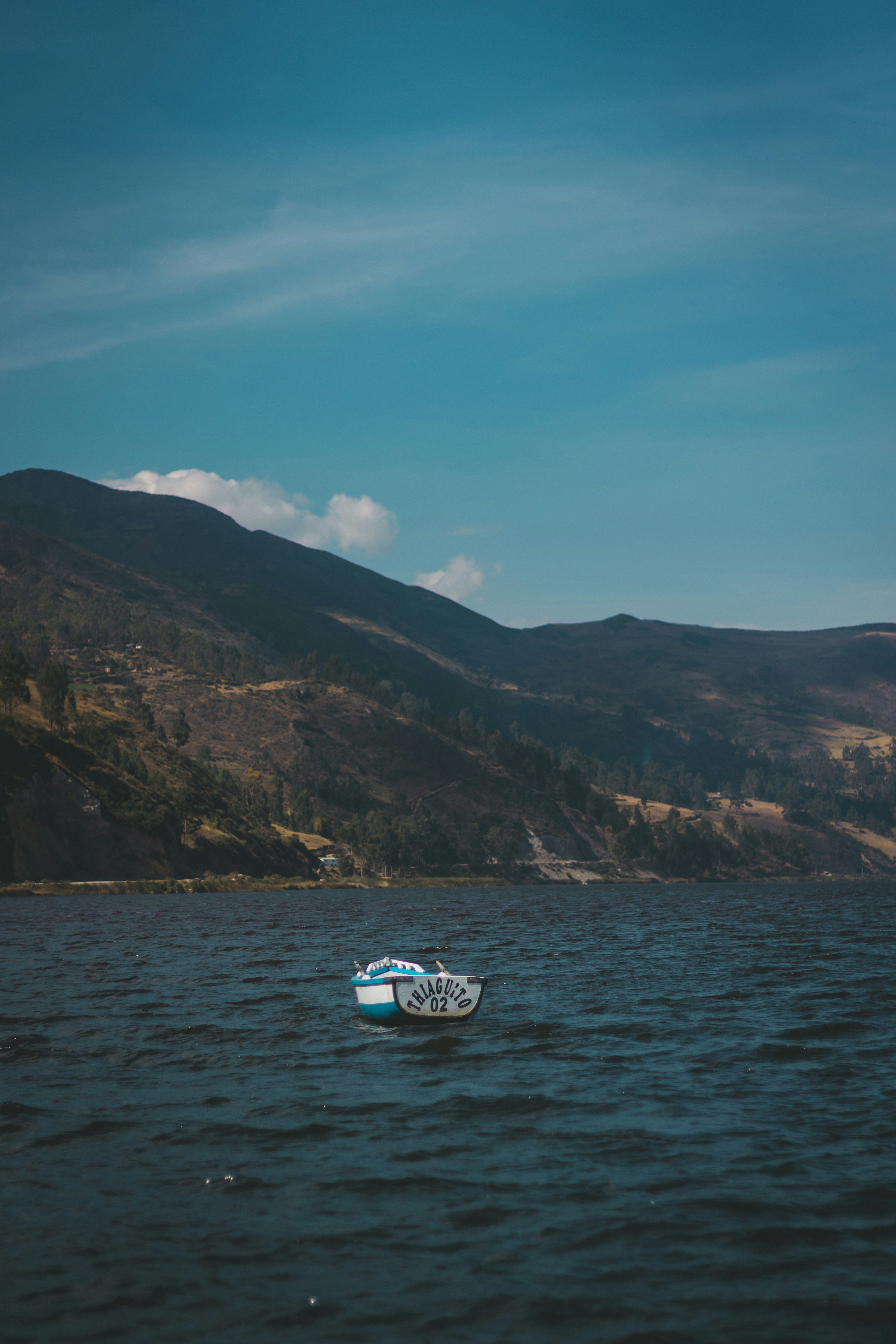 White row boat on lake photo – Free Blue Image on Unsplash