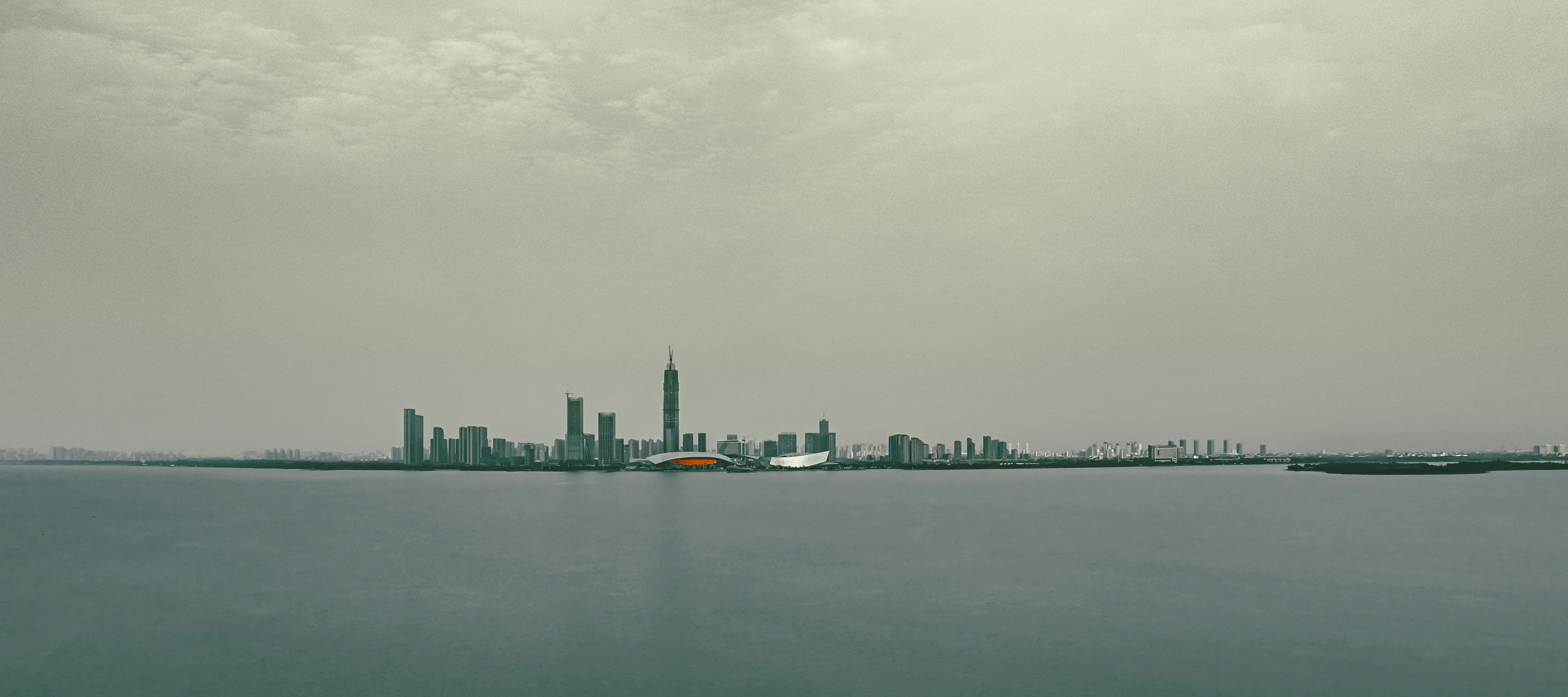 Grey concrete building near body of water during daytime photo – Free ...