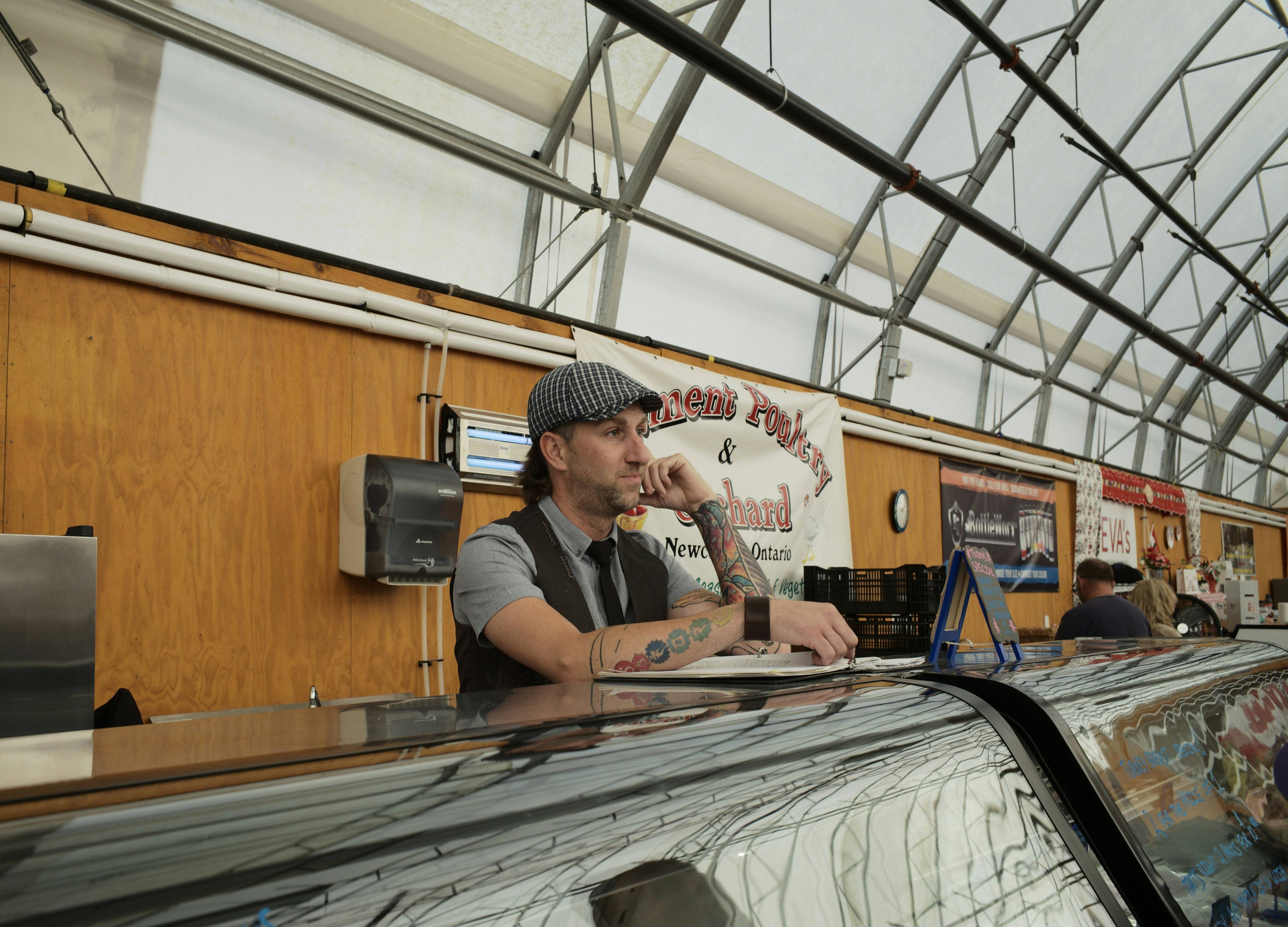 Man leaning on counter photo – Free Brown Image on Unsplash
