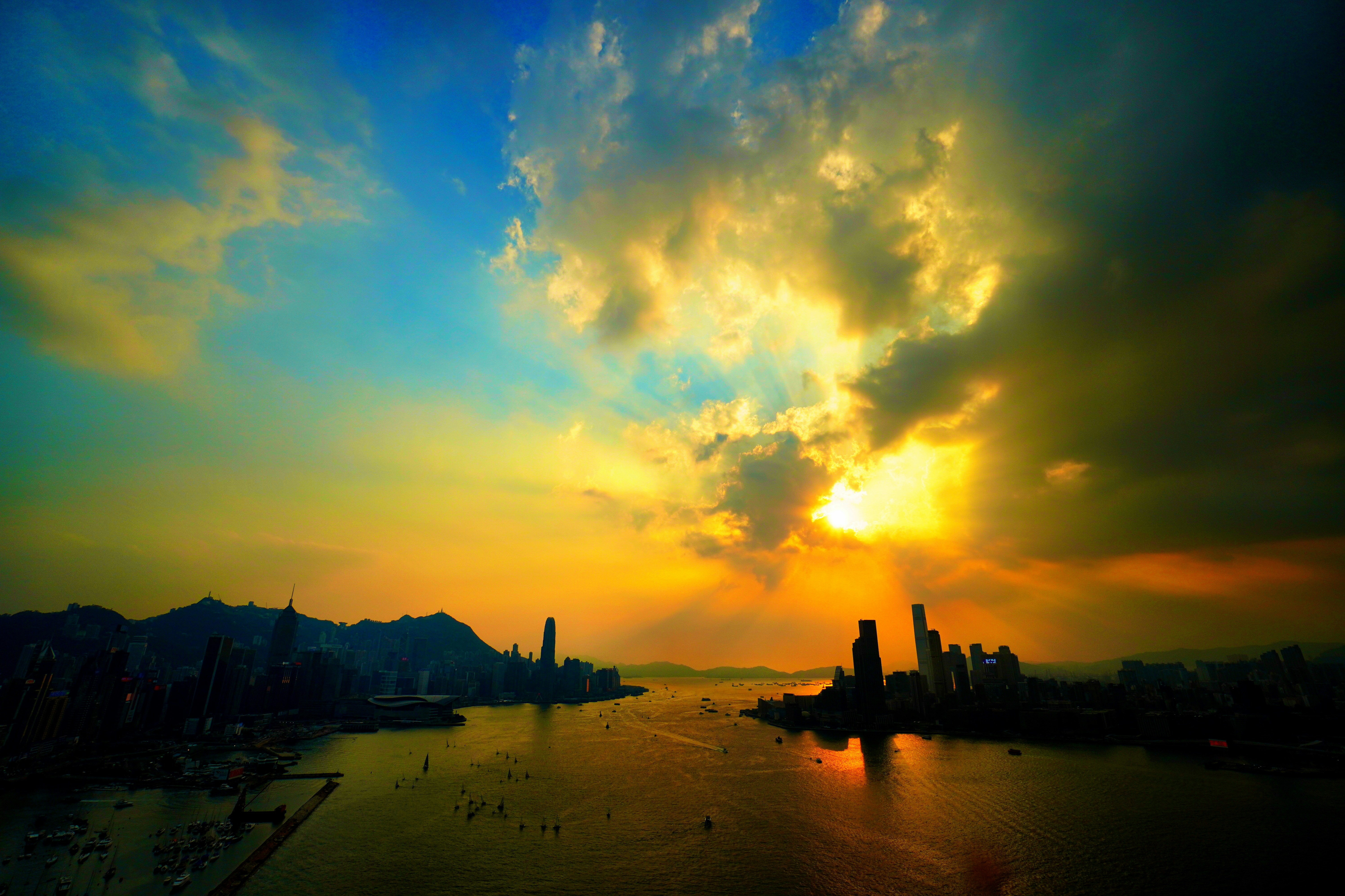 Ember Horizon Over a Silhouetted Harbor Skyline